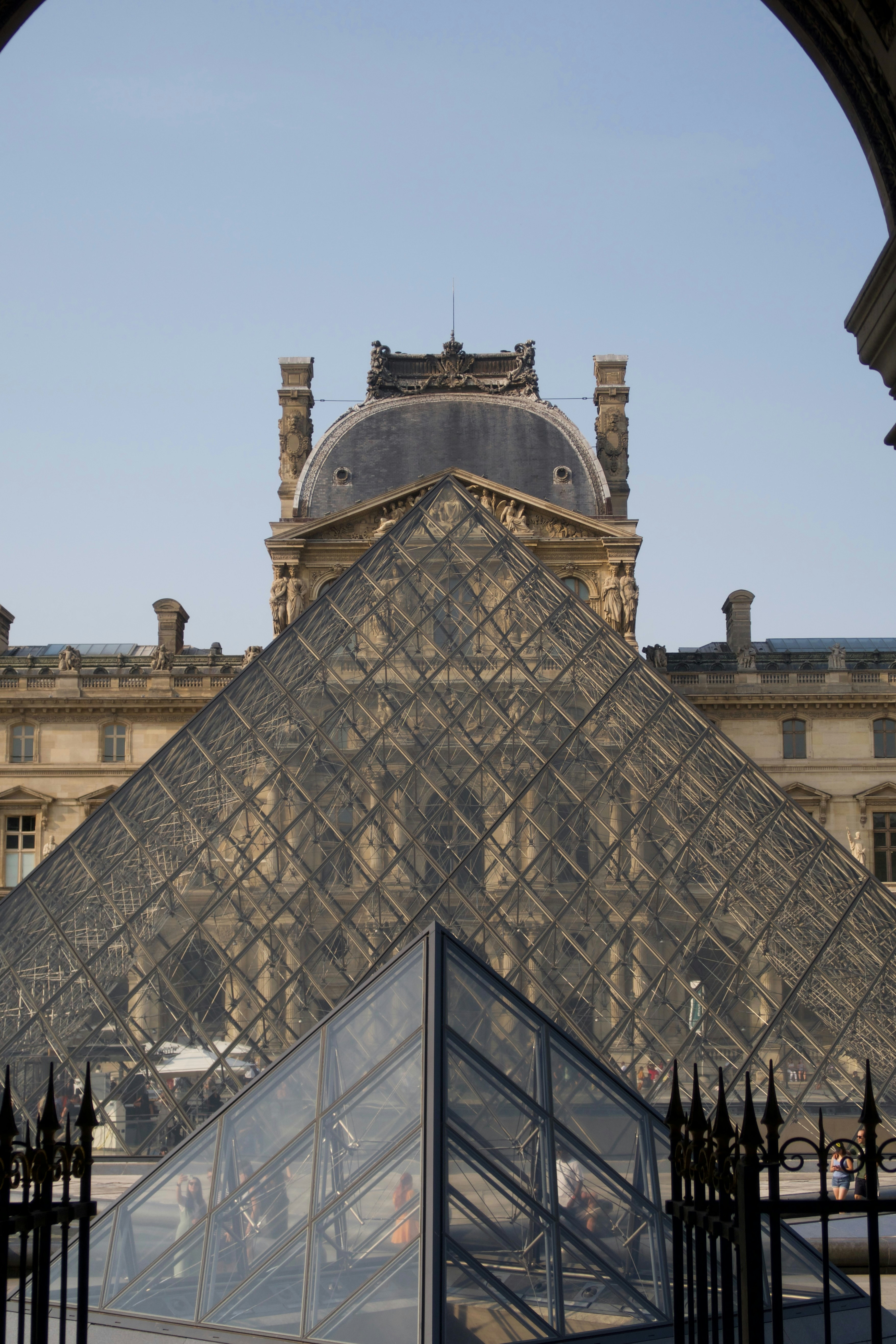 Glass Pyramid Reflections: A Louvre Moment