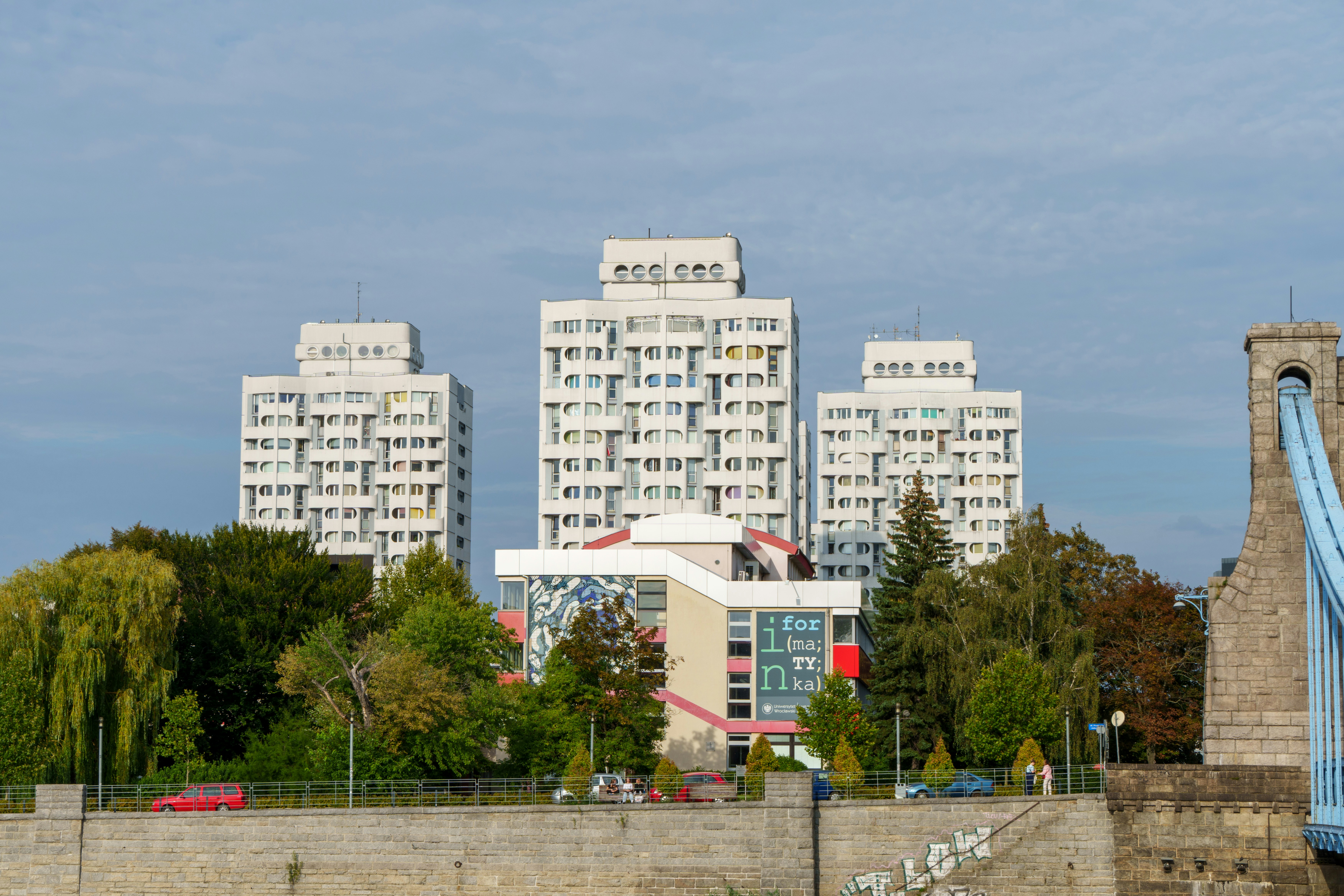 Urban Multifold: White Residential Towers Rising Over Riverside Park