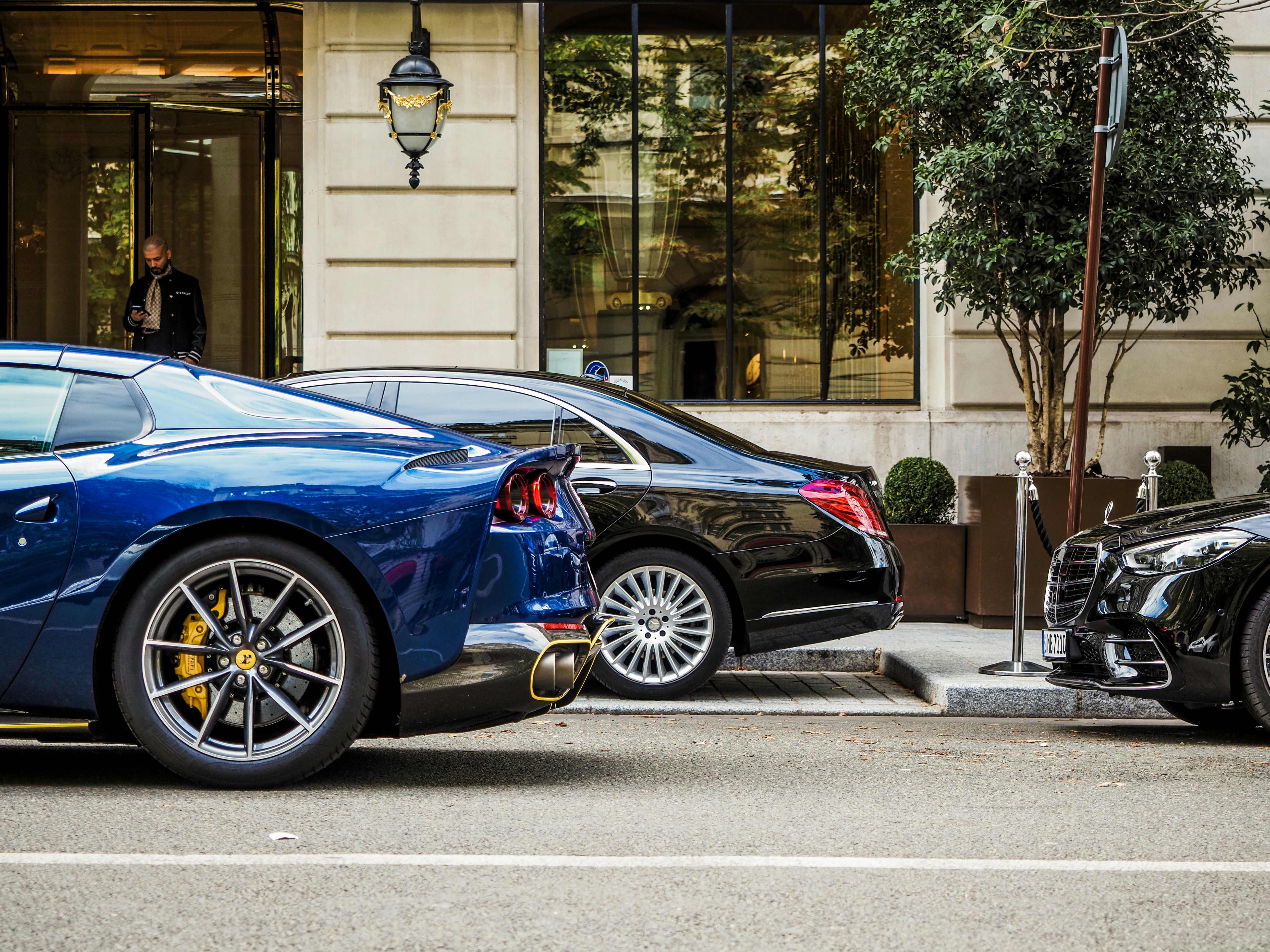 Blue Ferrari and Luxe Streetline: A Quiet Carspot on a City Street