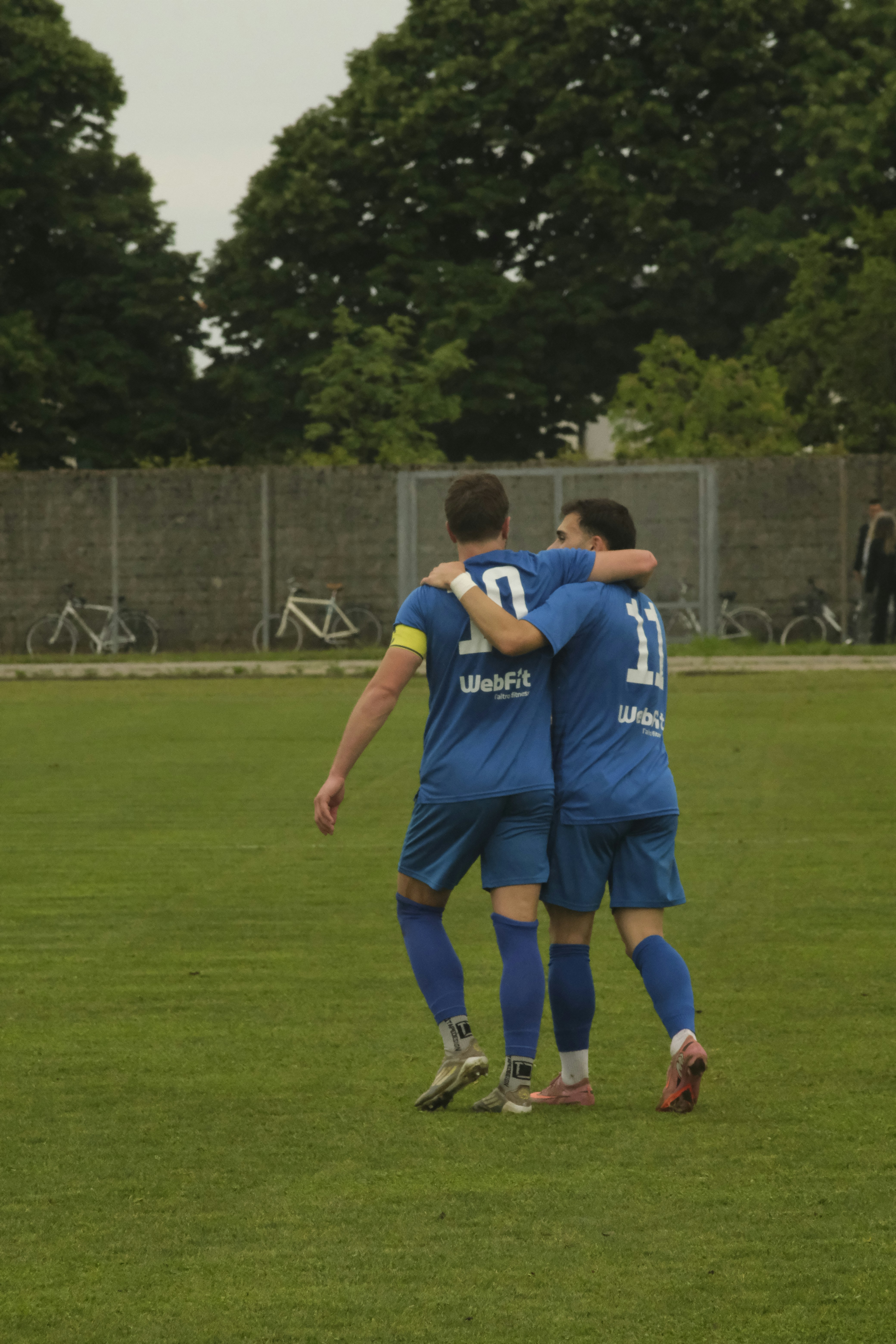 Blue Jersey Champions: Shared Moment on the Field