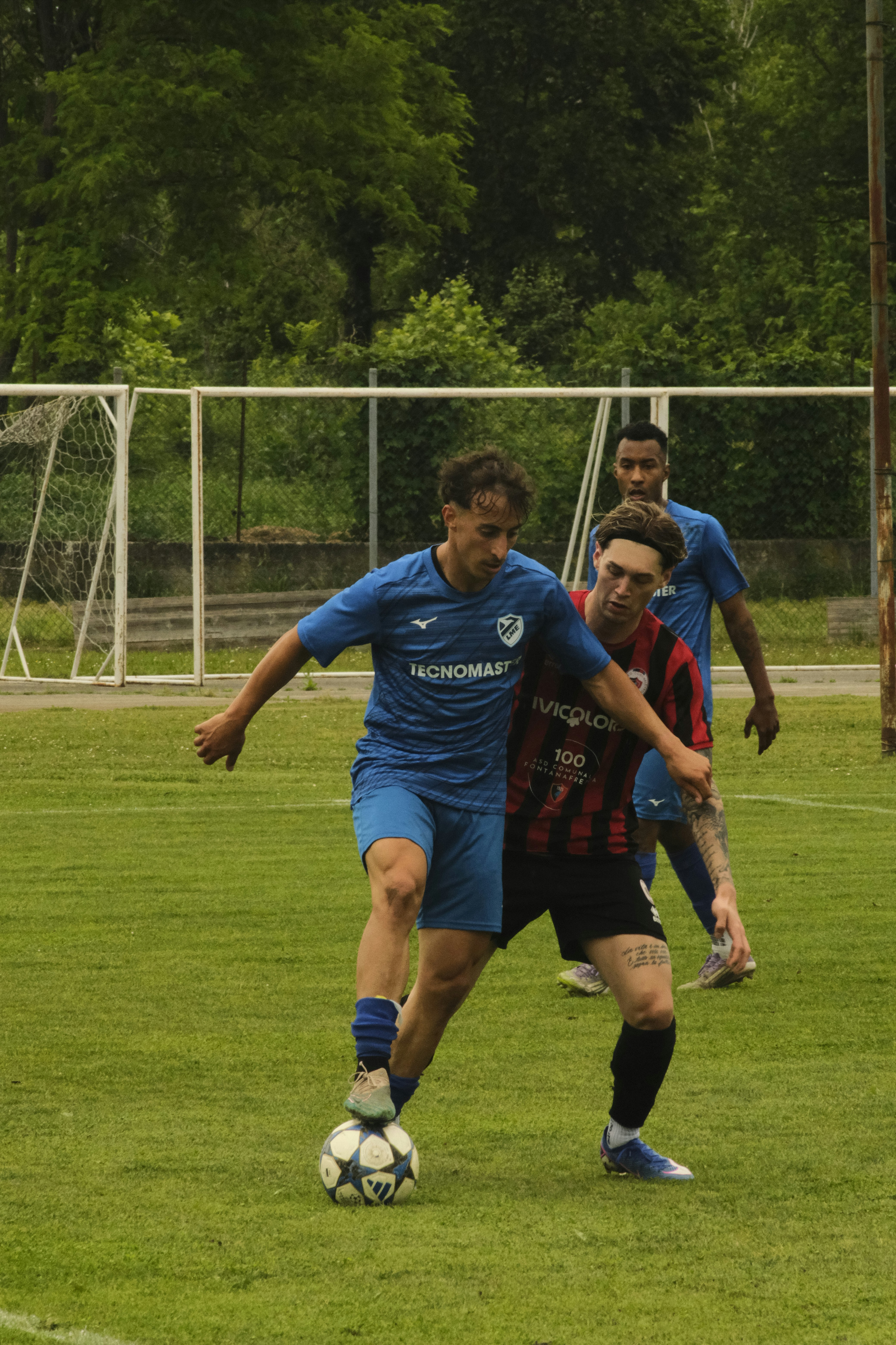 Triad in Midfield: A Soccer Duel by the Open Goal