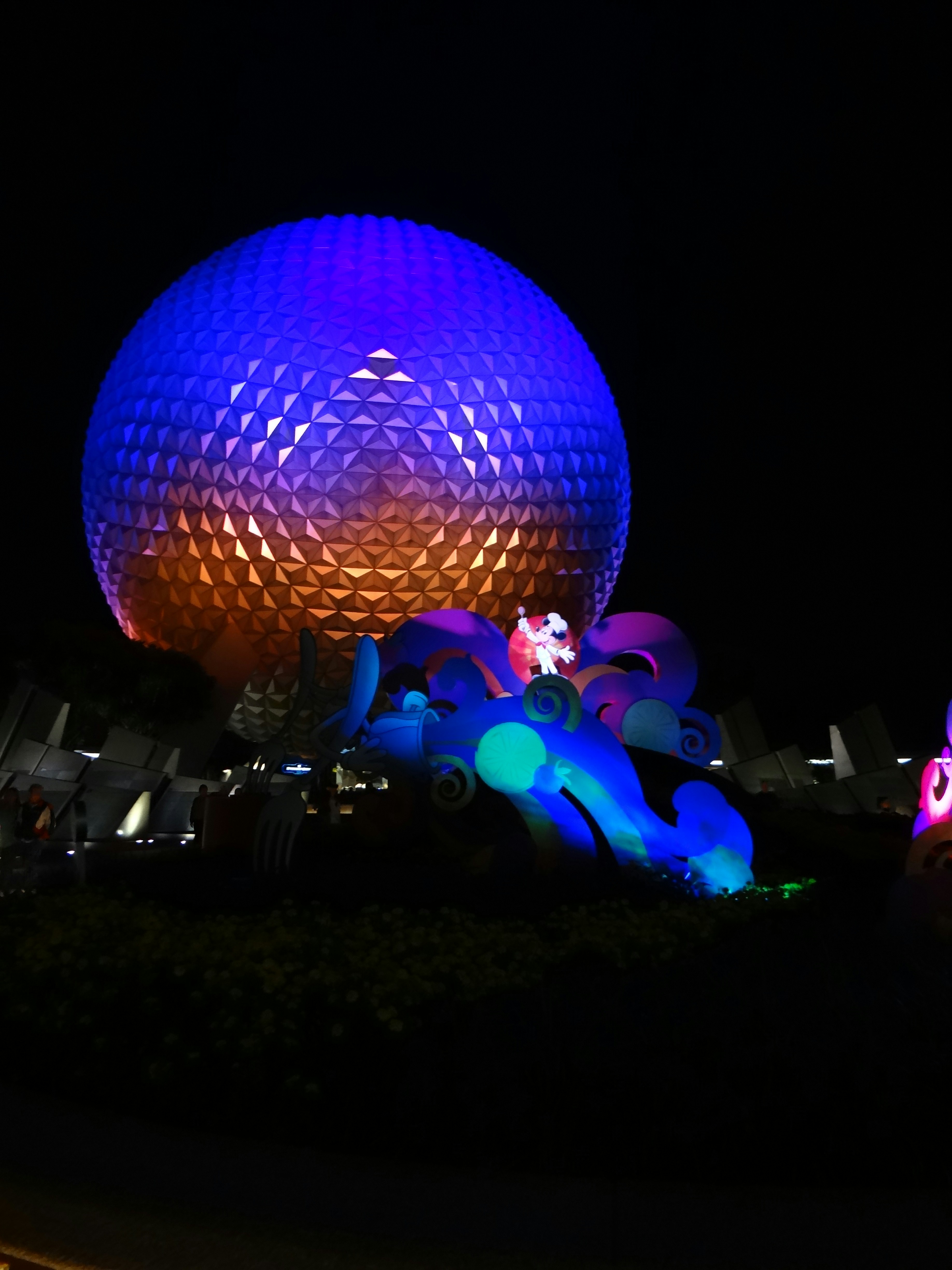 Glowing Sphere at Night: A Colorful Confluence of Light and Art