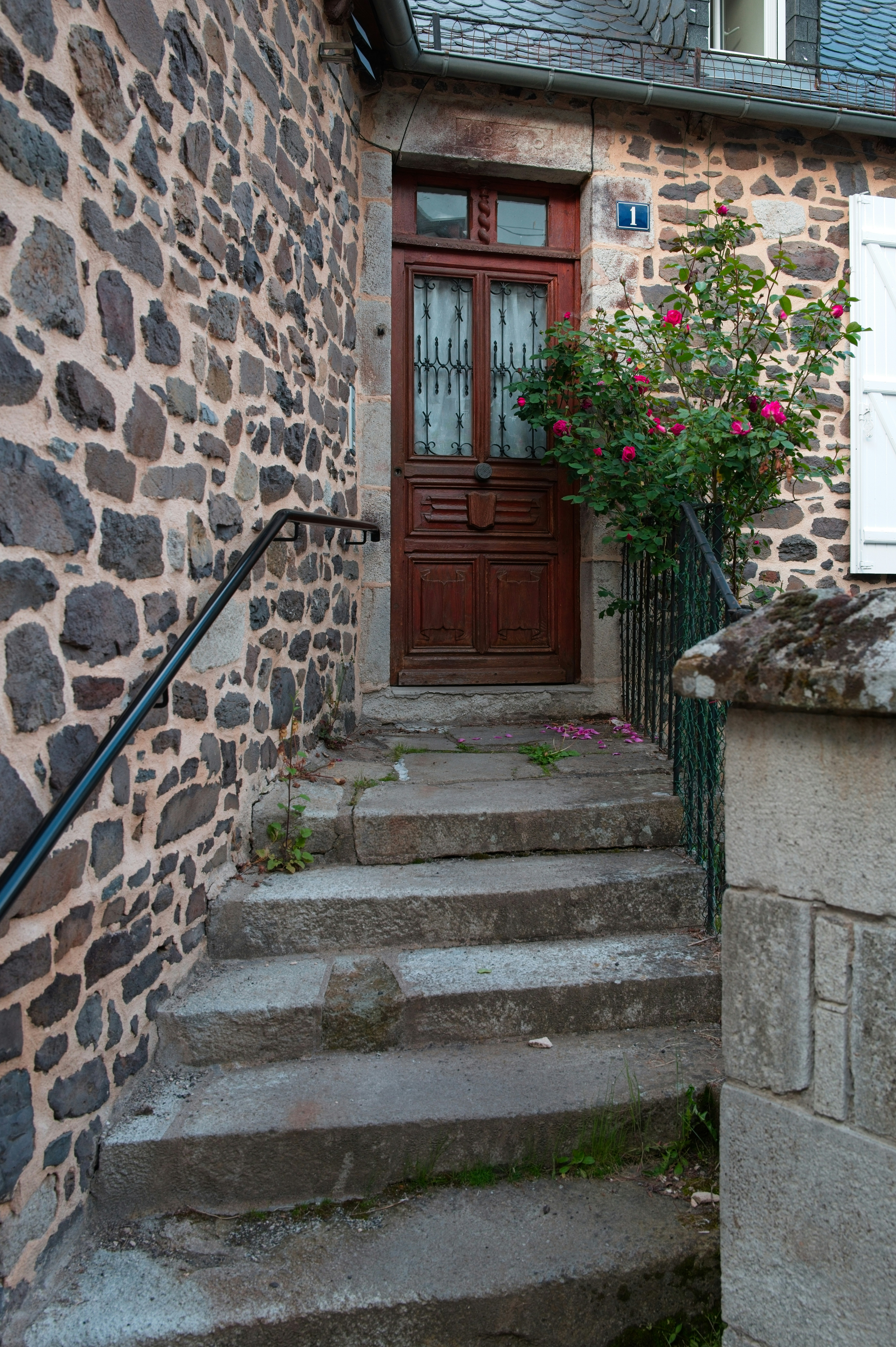 Weathered doorway along a stone stairway