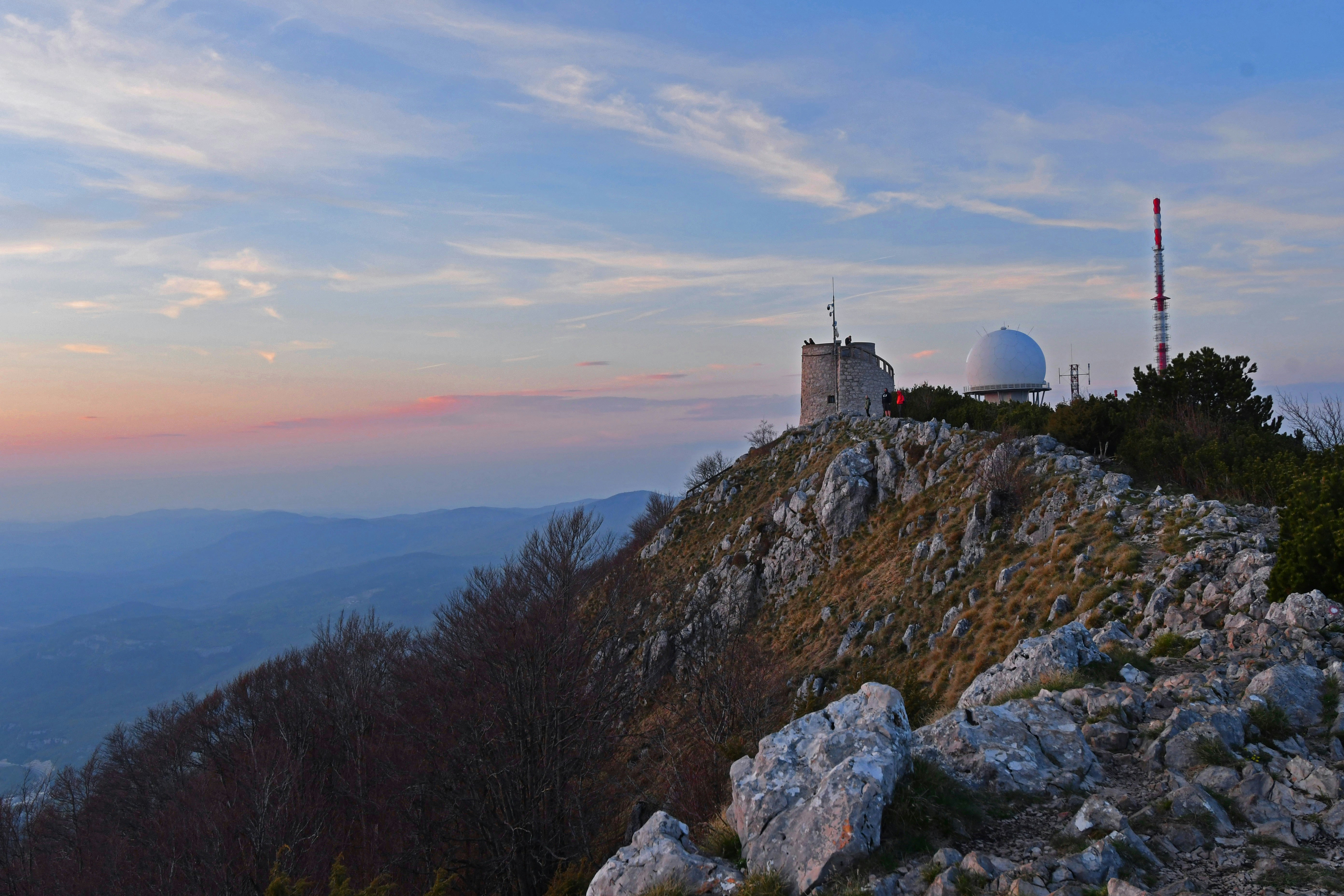 Ridge Observatory at Sunset: A Weathered Summit with Dome and Antenna