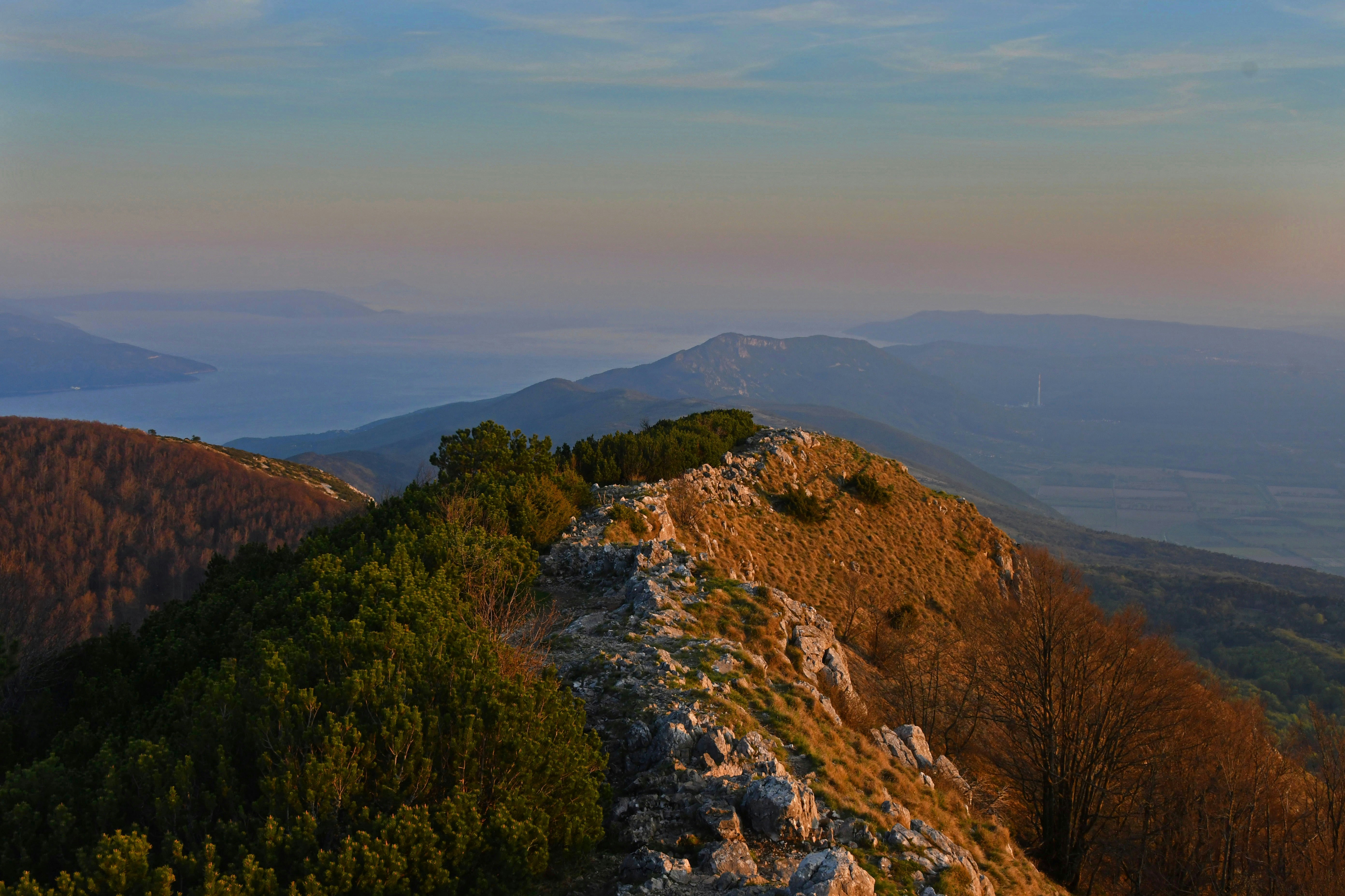 Midday Ridge: Cliff Path Leading to Distant Misty Valleys