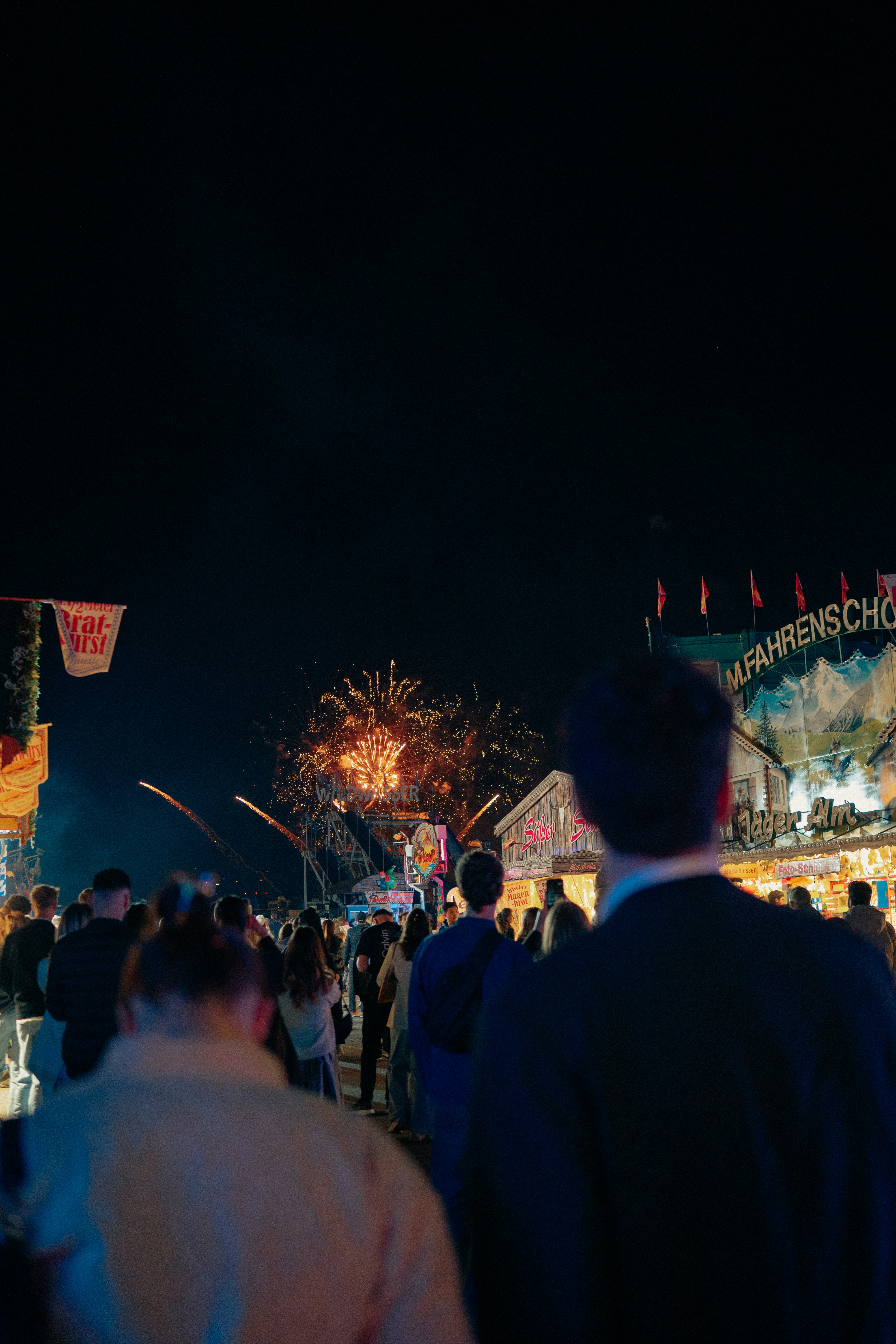 Night Fairway: Fireworks Above a Crowded Carnival