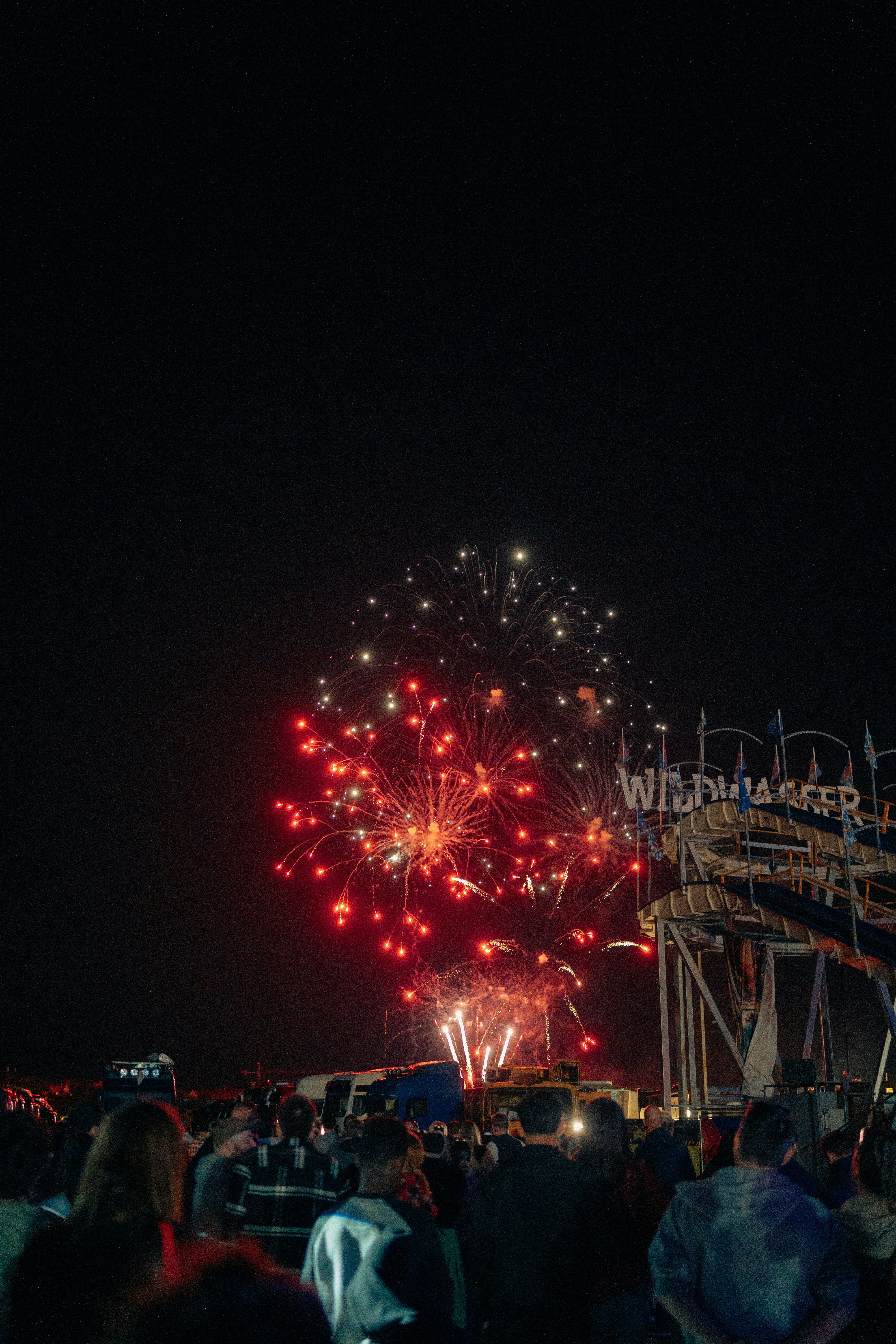 Crowd watches fireworks display at night photo – Free Night sky Image ...