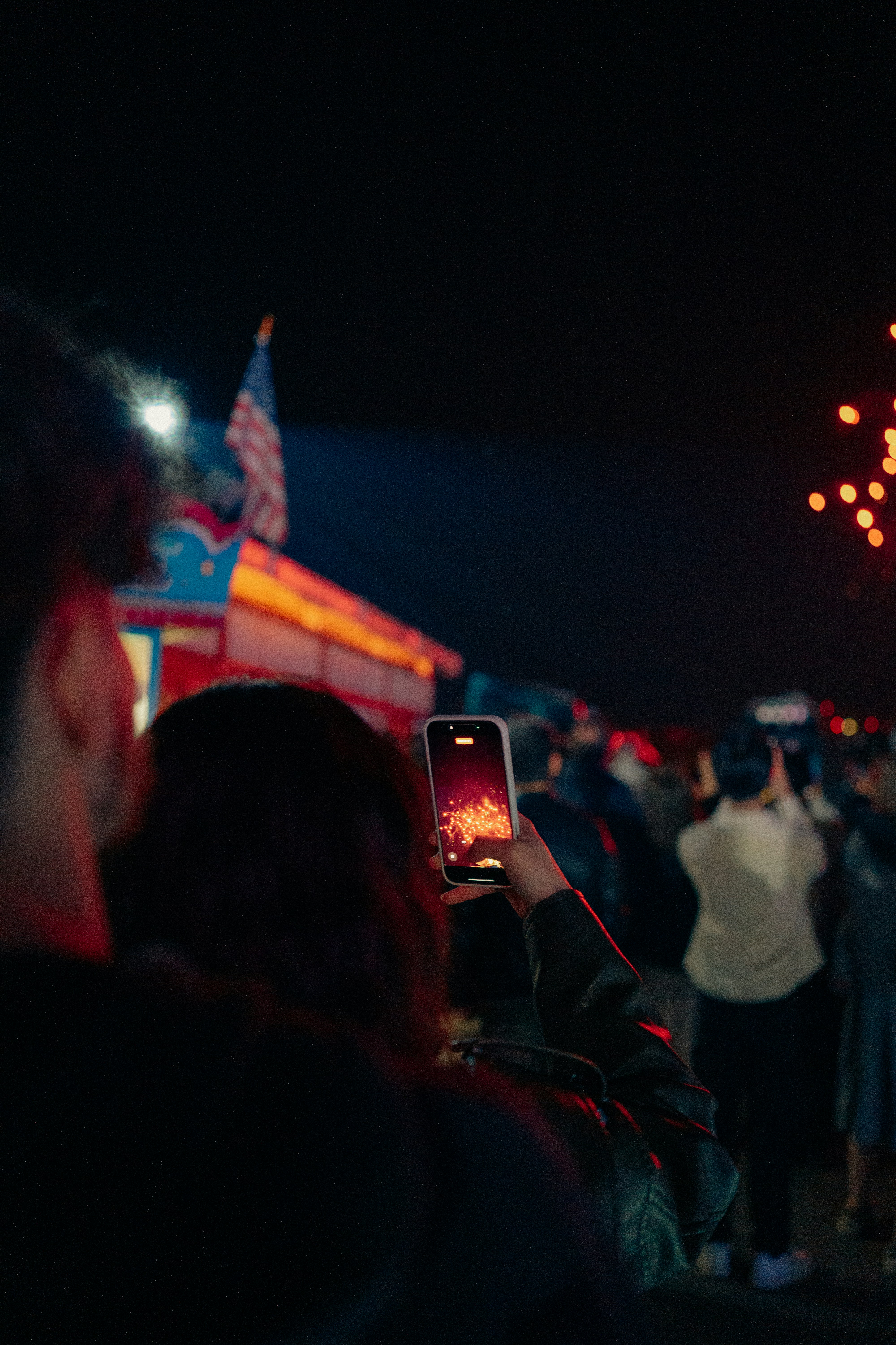 People watch fireworks at night with a phone recording photo – Free ...