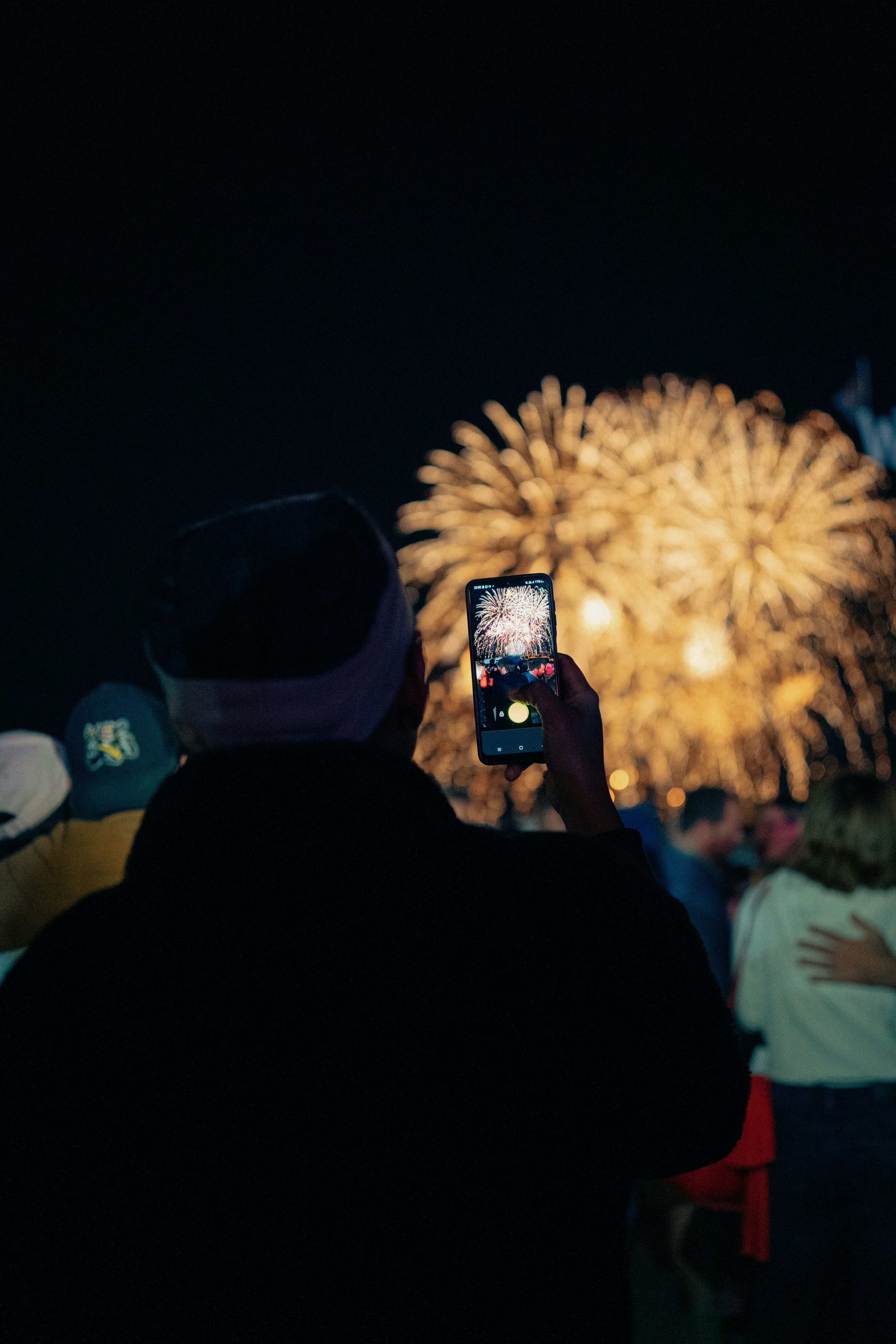 Person films fireworks on smartphone at night. photo – Free Night sky ...