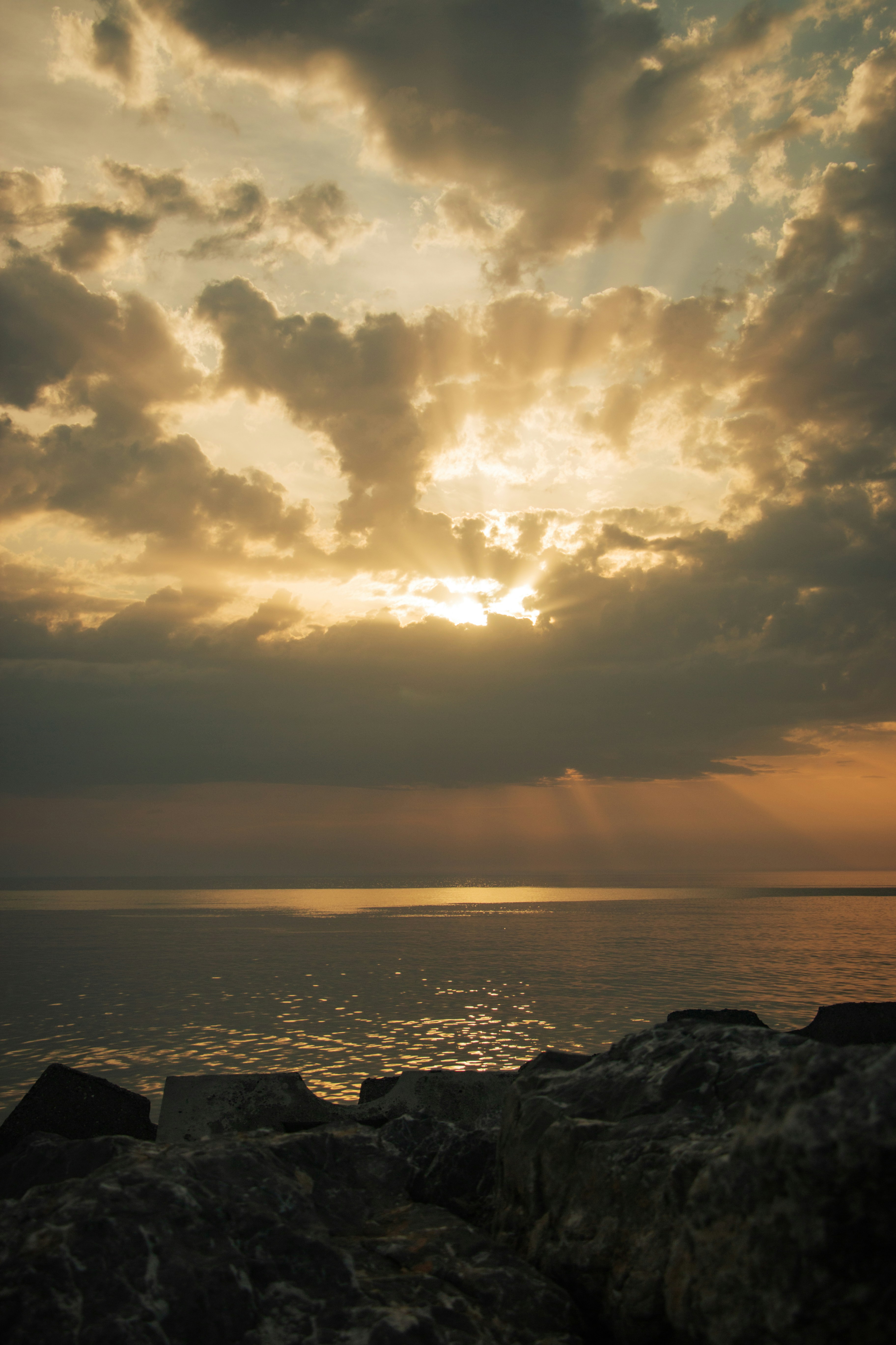 Sunlit Overlook: Golden Hour Sparks Over a Quiet Sea