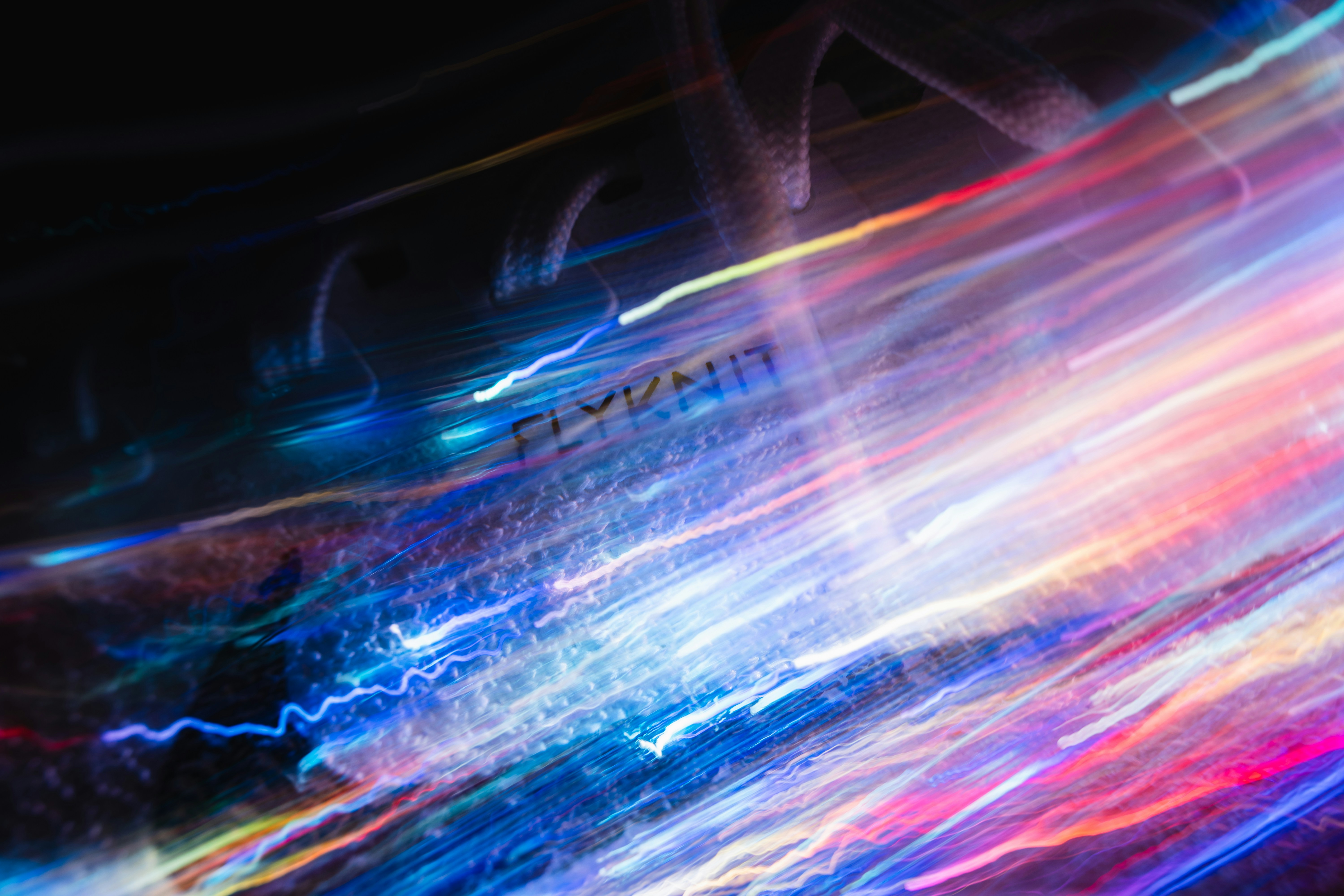 Blurred Neon Wake: A Velocity of Lights