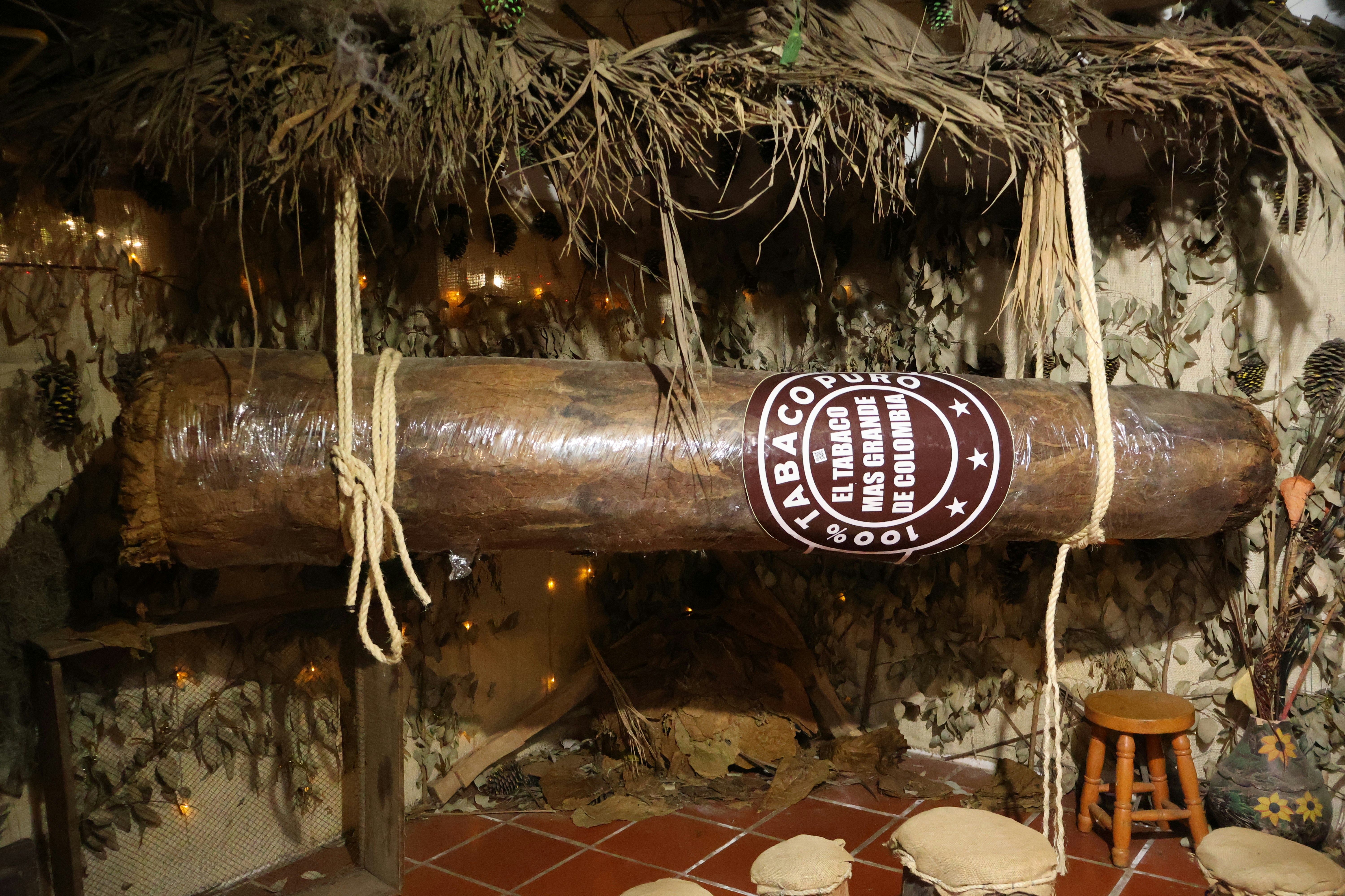 The Dim Santo: A Wooden Cigar Roll in a Rustic Display
