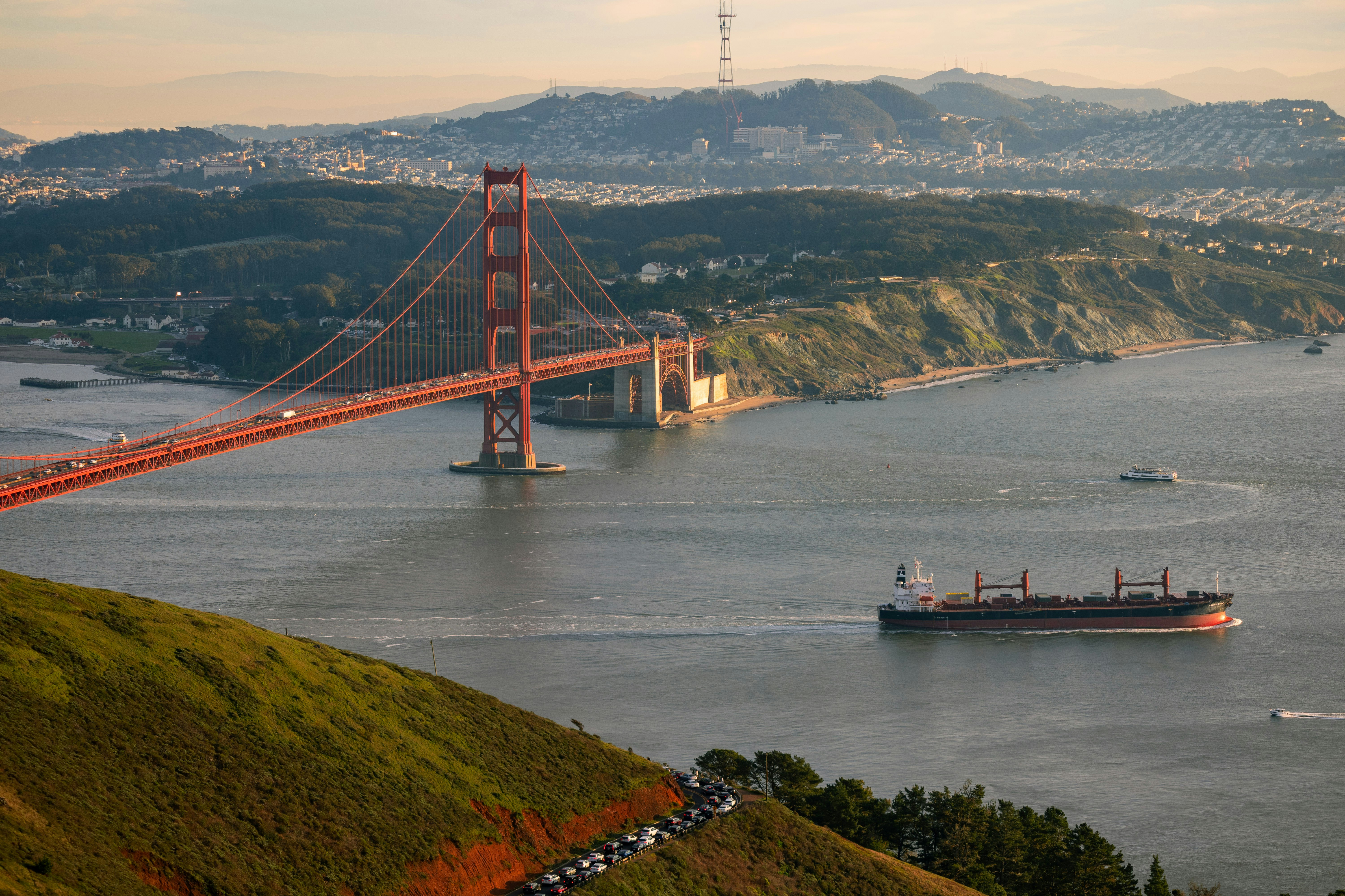 Bridge over the Bay: Golden Gate-esque Span Framing a Freight Vessel