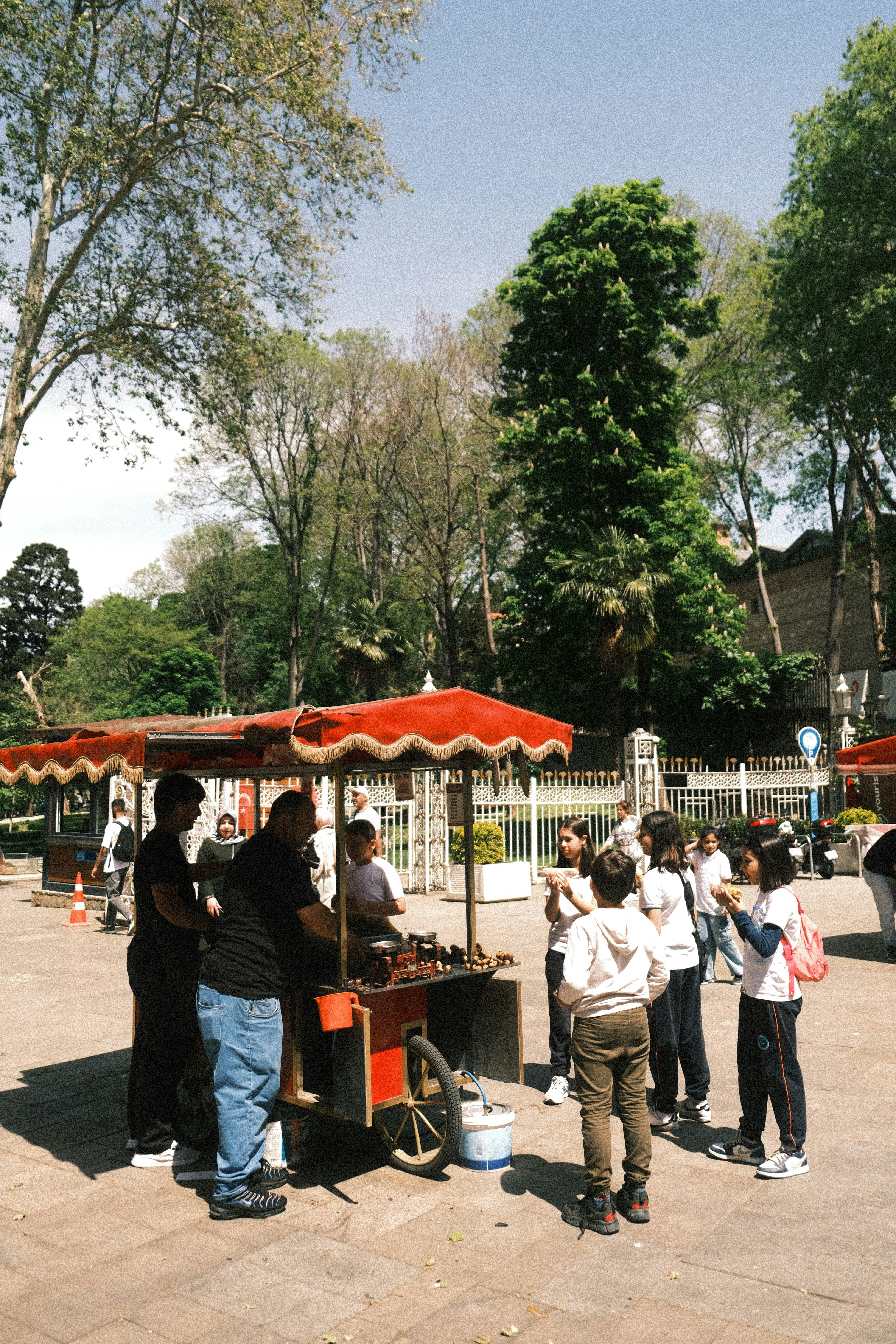 Streetfood Stand Under Orange Canopy Draws a Crowd
