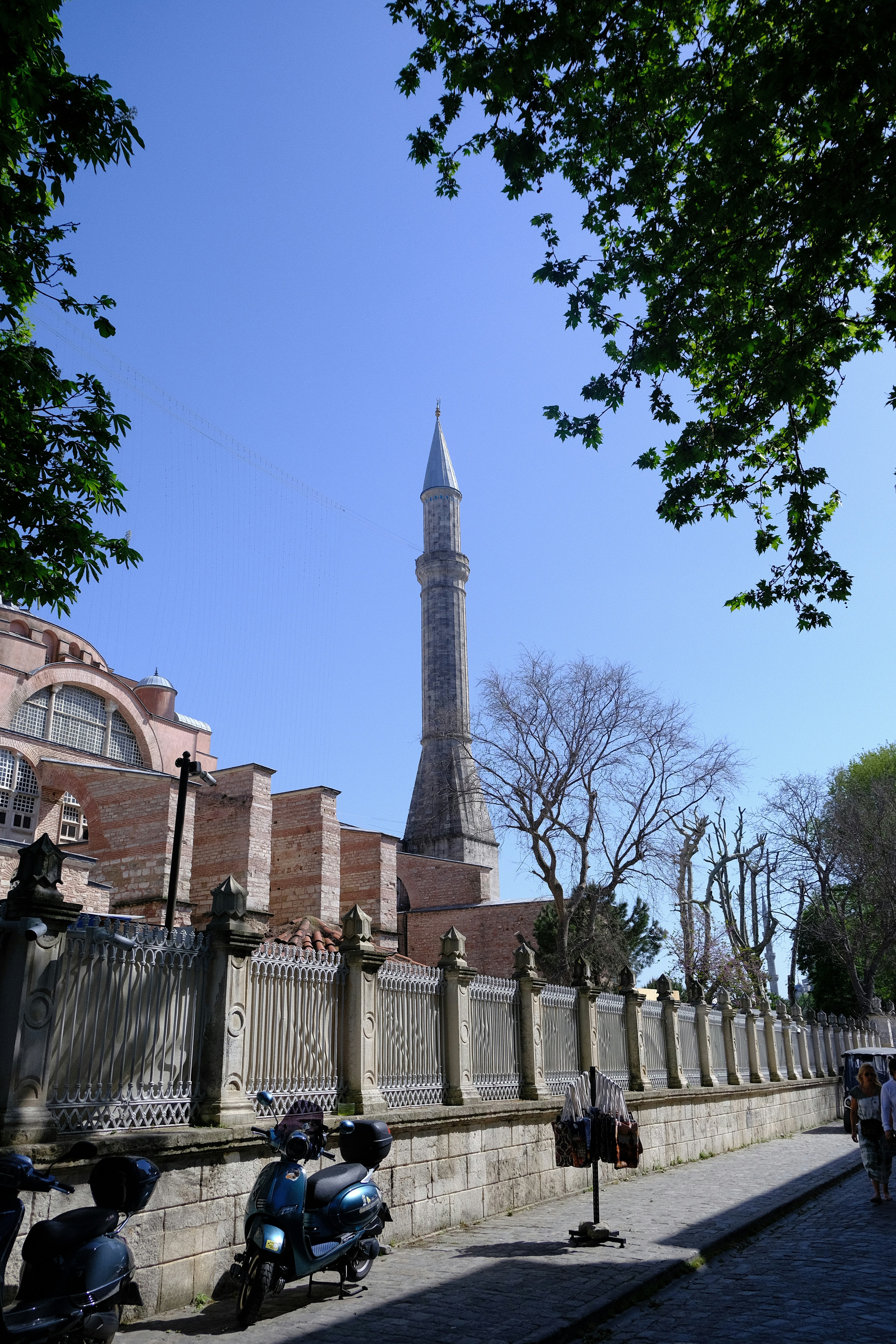 Minaret in the Courtyard: A Sunlit Street of Stony Fences