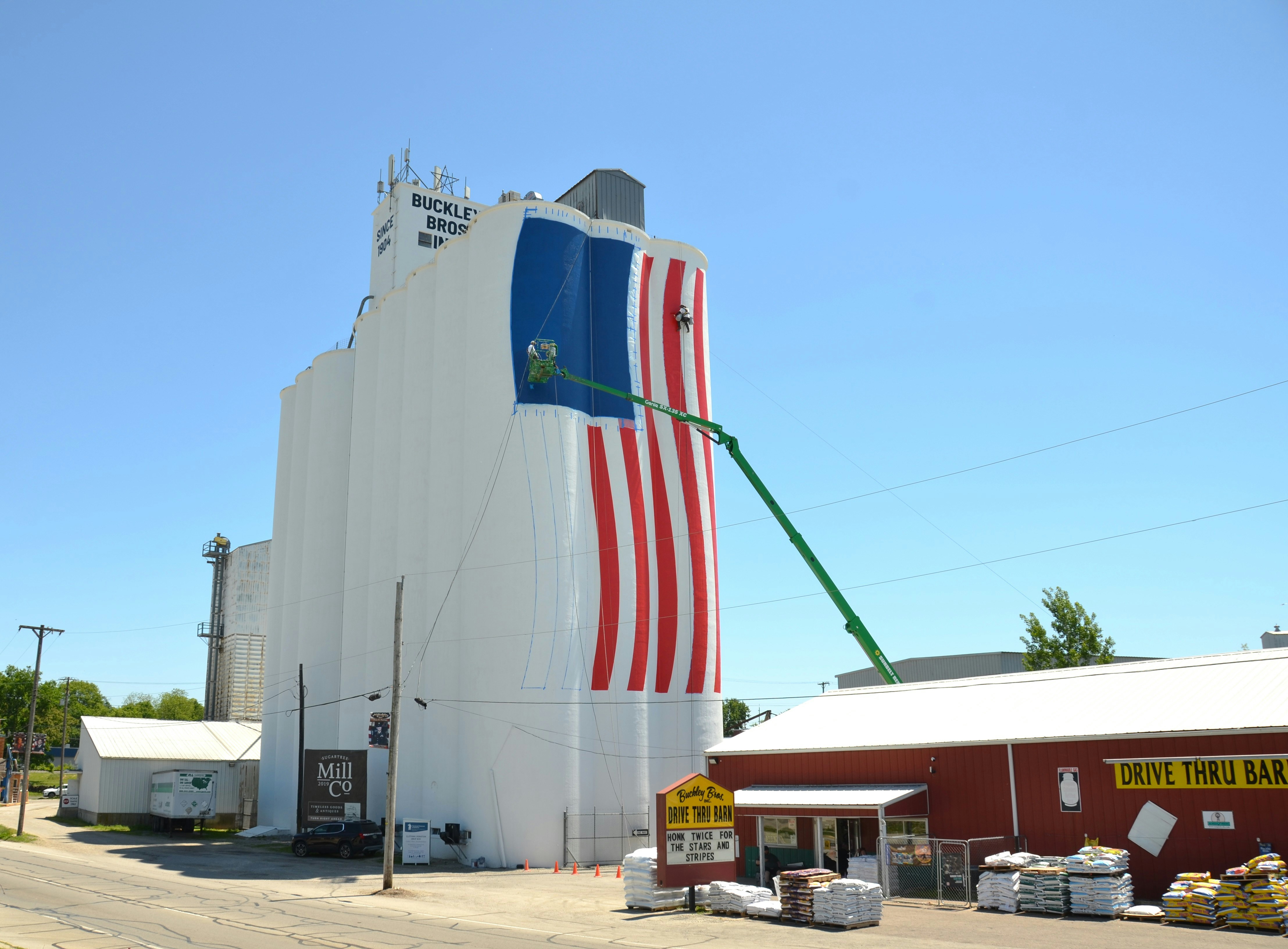 Silo with Giant American Flag Mural and Drive-Thru Barn