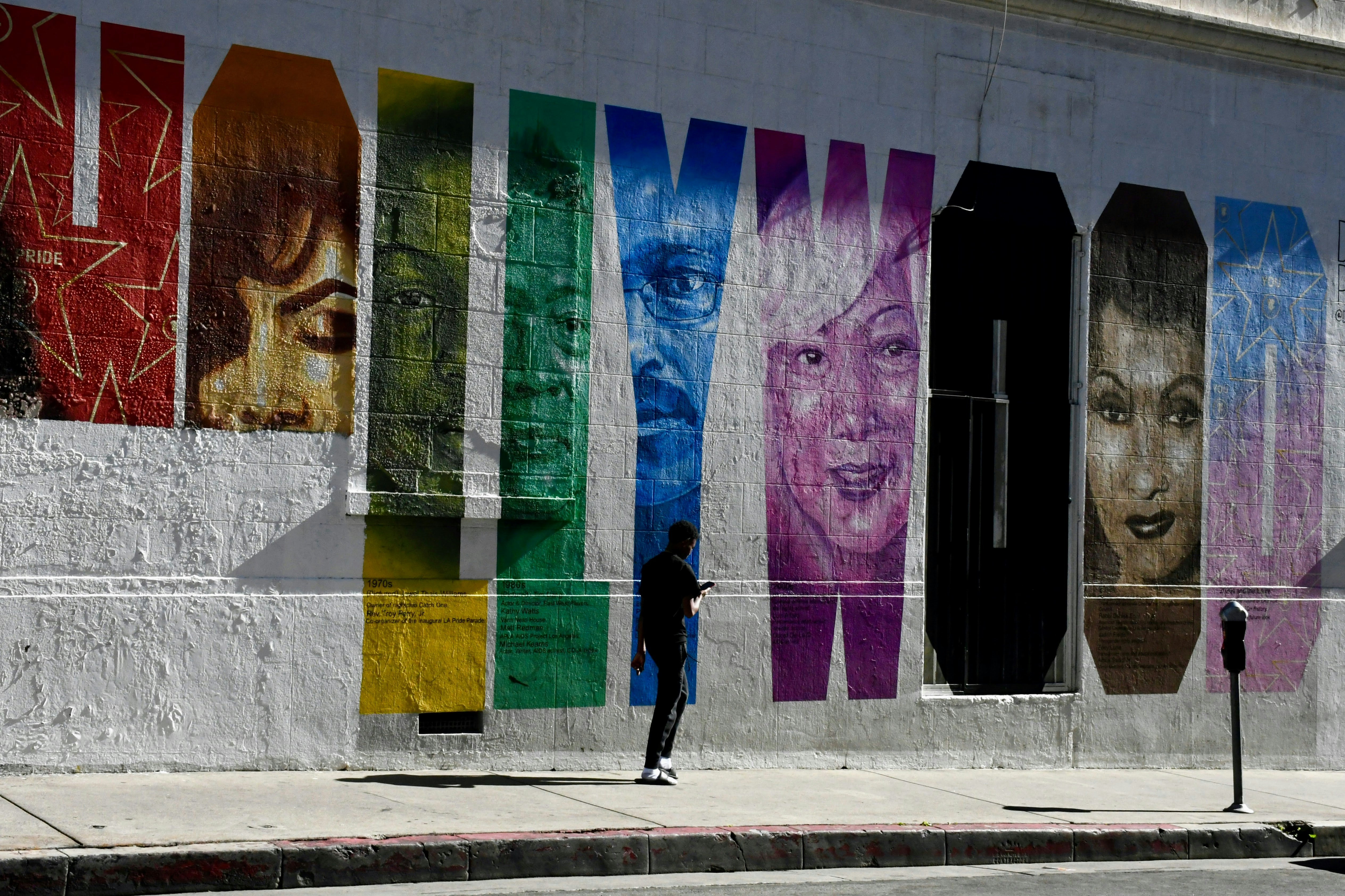 Walking through a Chromatic Portrait: A Silhouette Before Vivid Murals