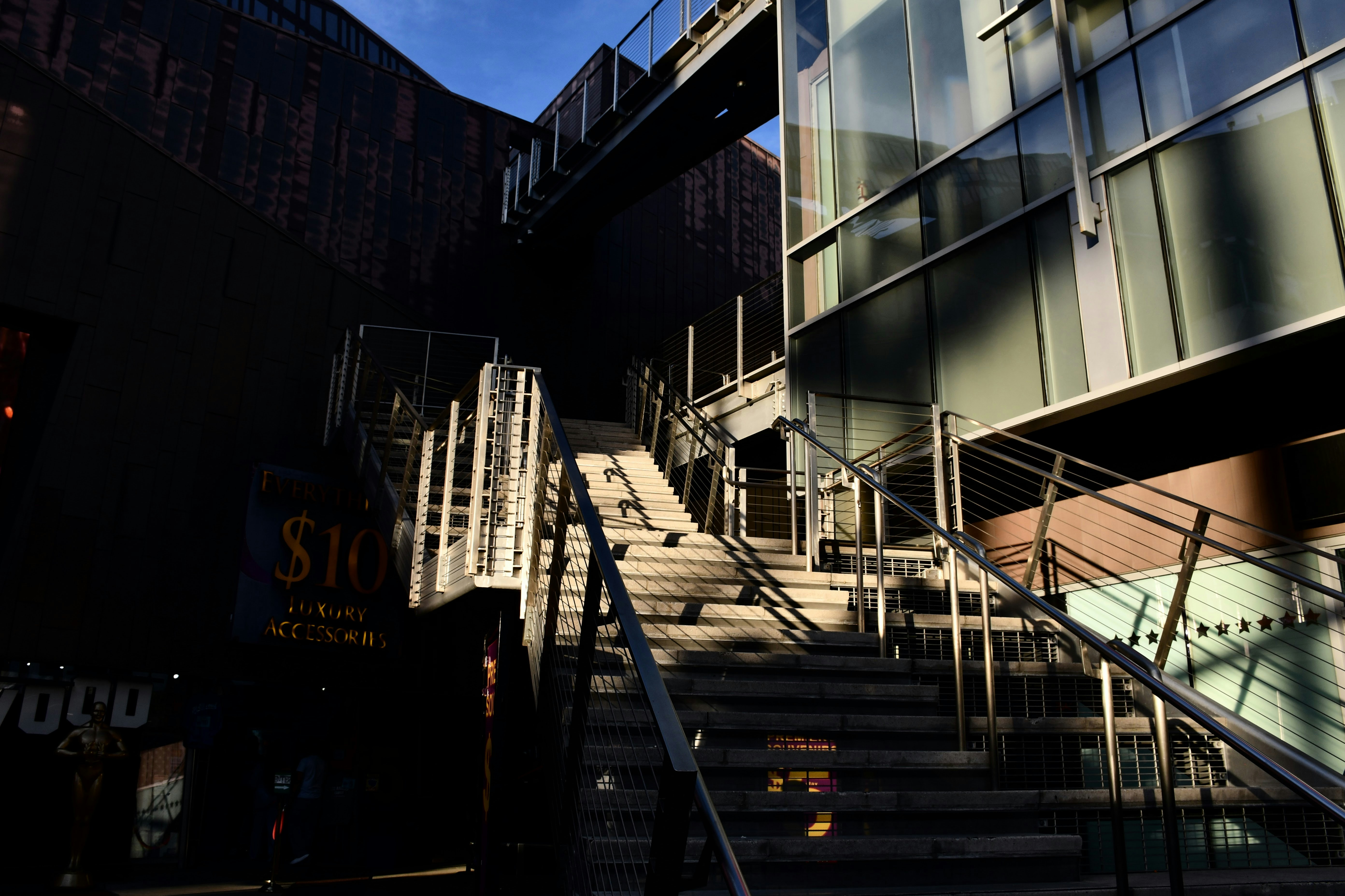 Urban Staircase Into Shadowed Glass and Steel