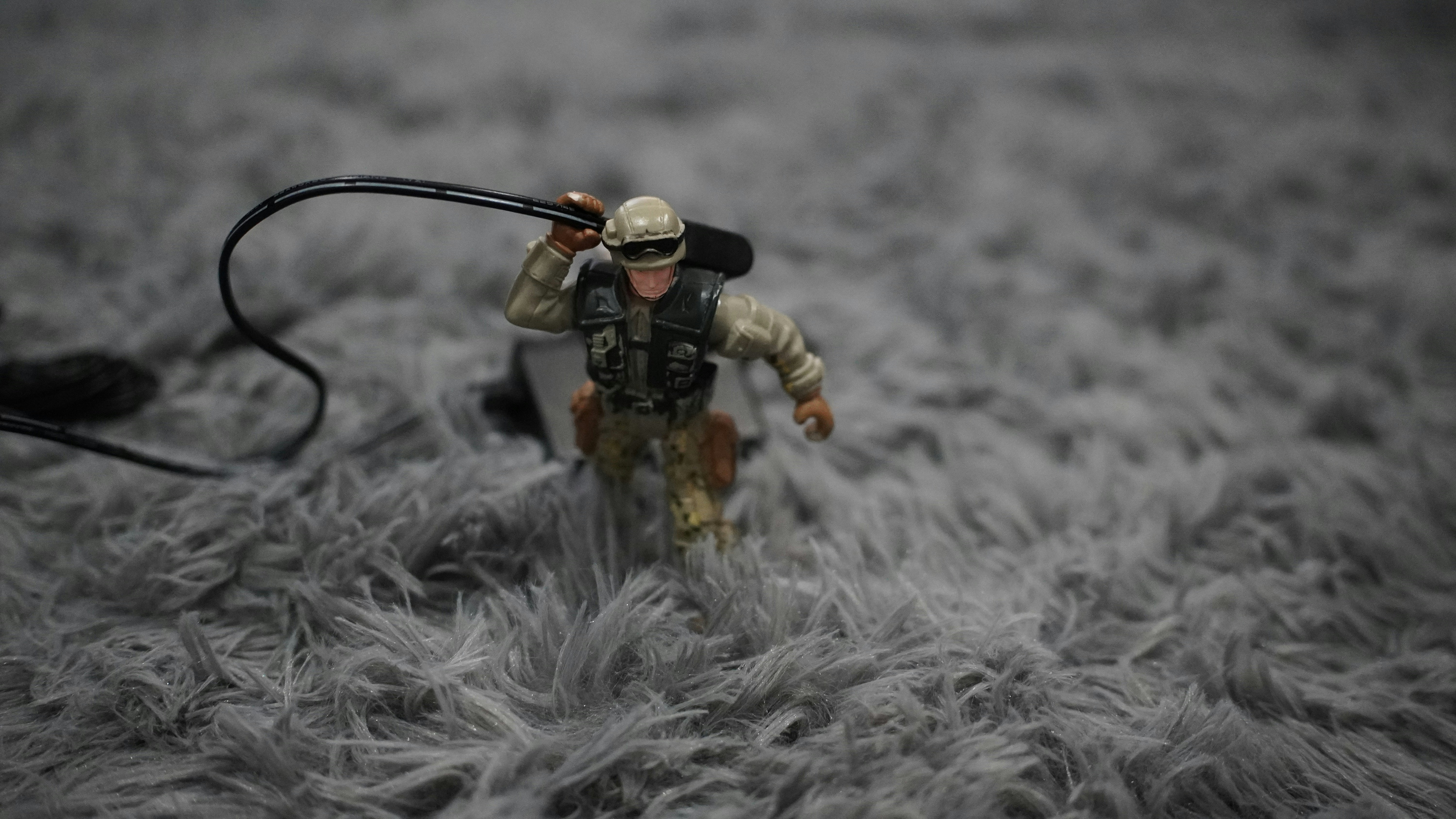 Toy Soldier in a Sea of Fur: A Miniature Hero on the Plush Frontline