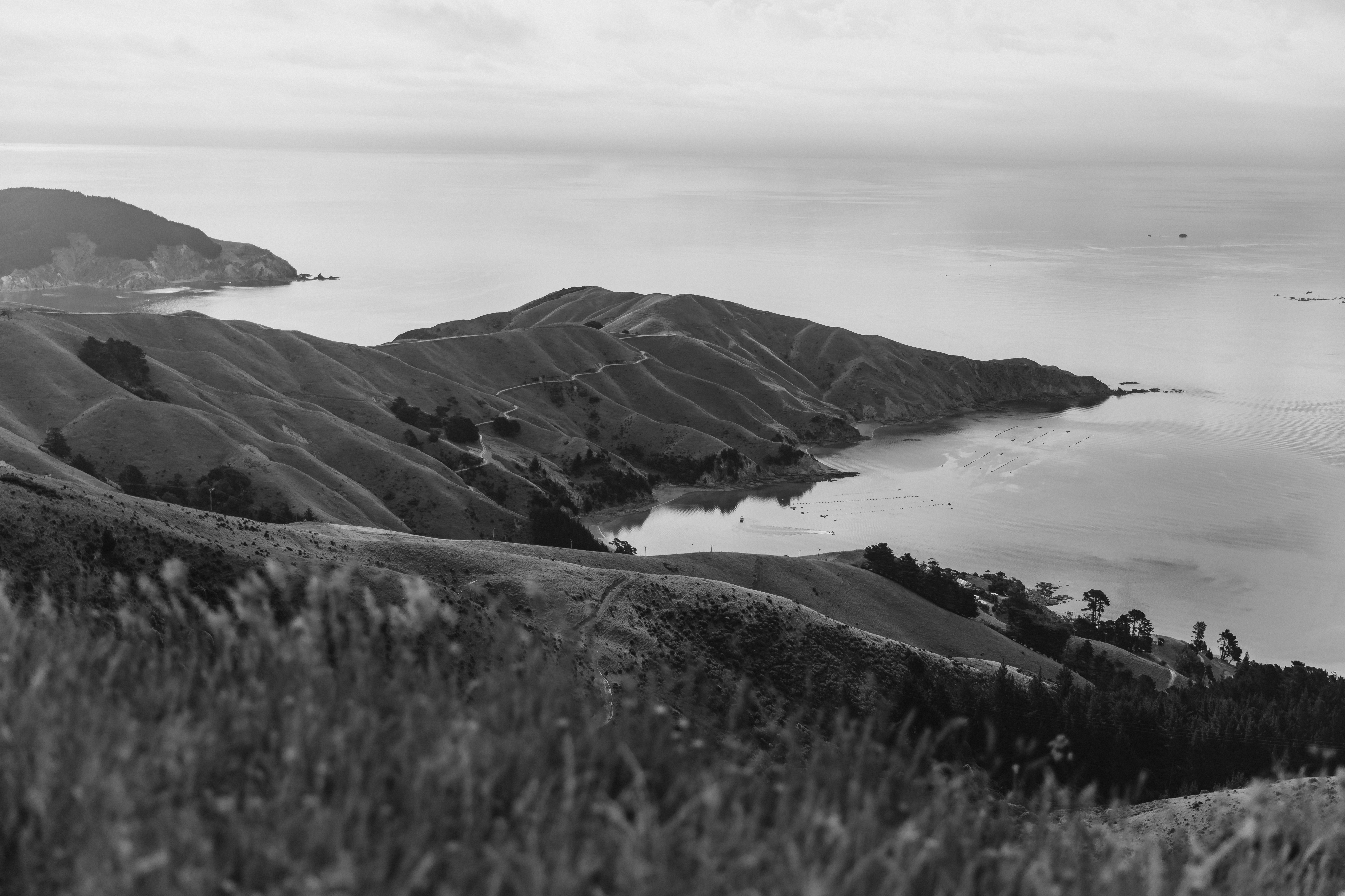Ridge Line Beneath an Espresso Sky Over Quiet Coast