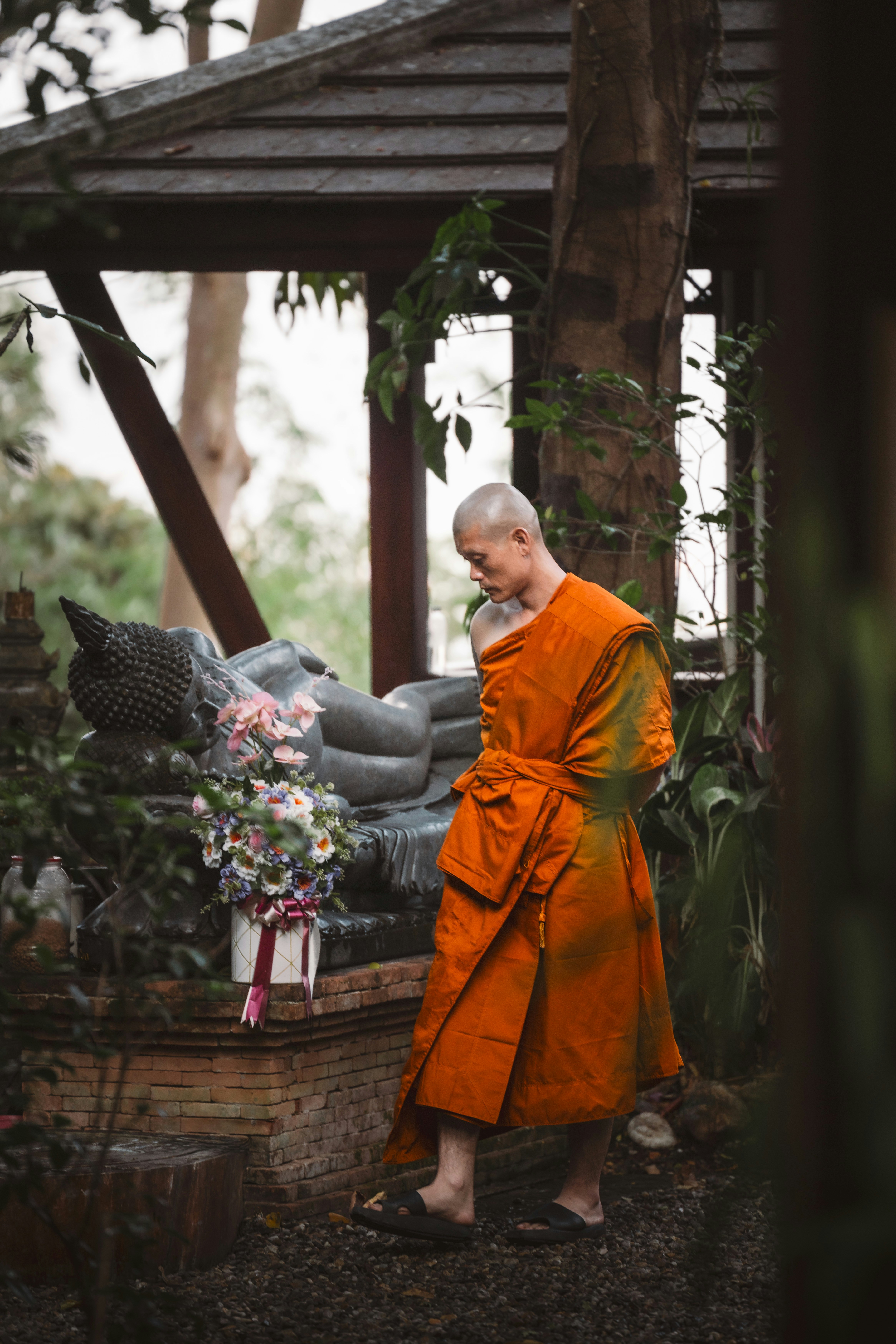 Quiet Ascetic: A Monk in Orange Amid Shrine Steps