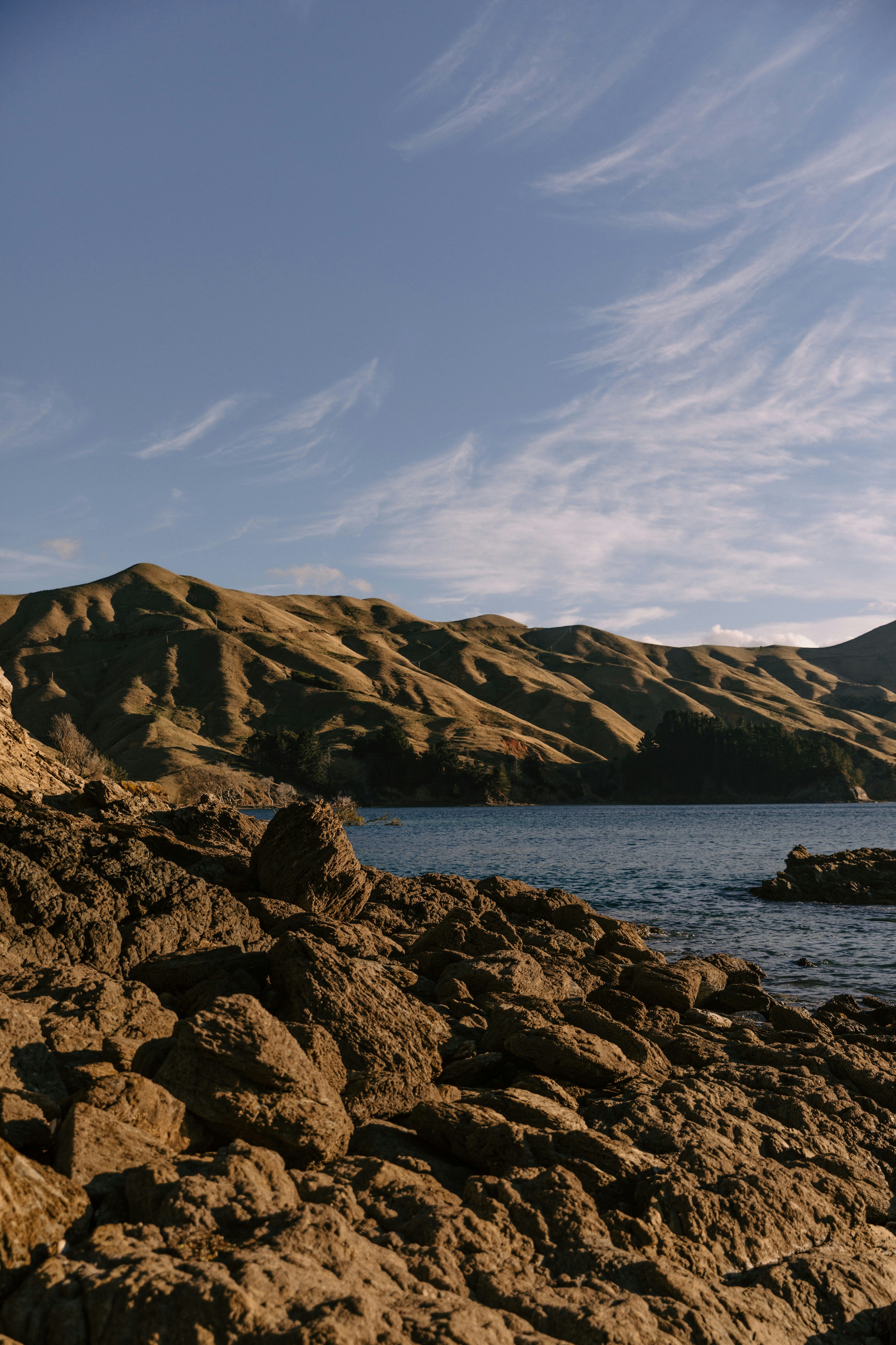 Shoreline Echoes beneath Aegean-like Skies