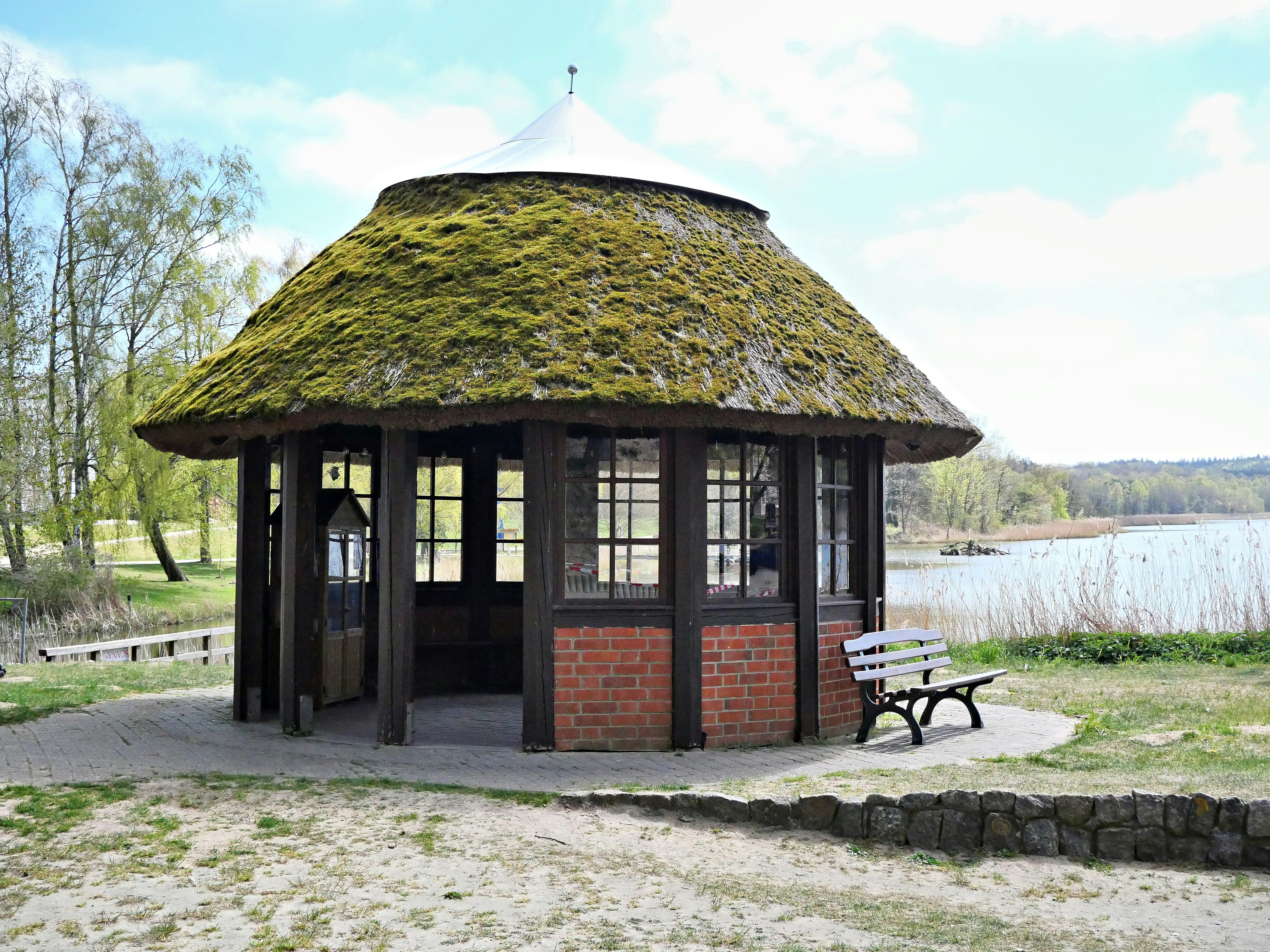 Moss-Covered Quonset Hut by the Lake
