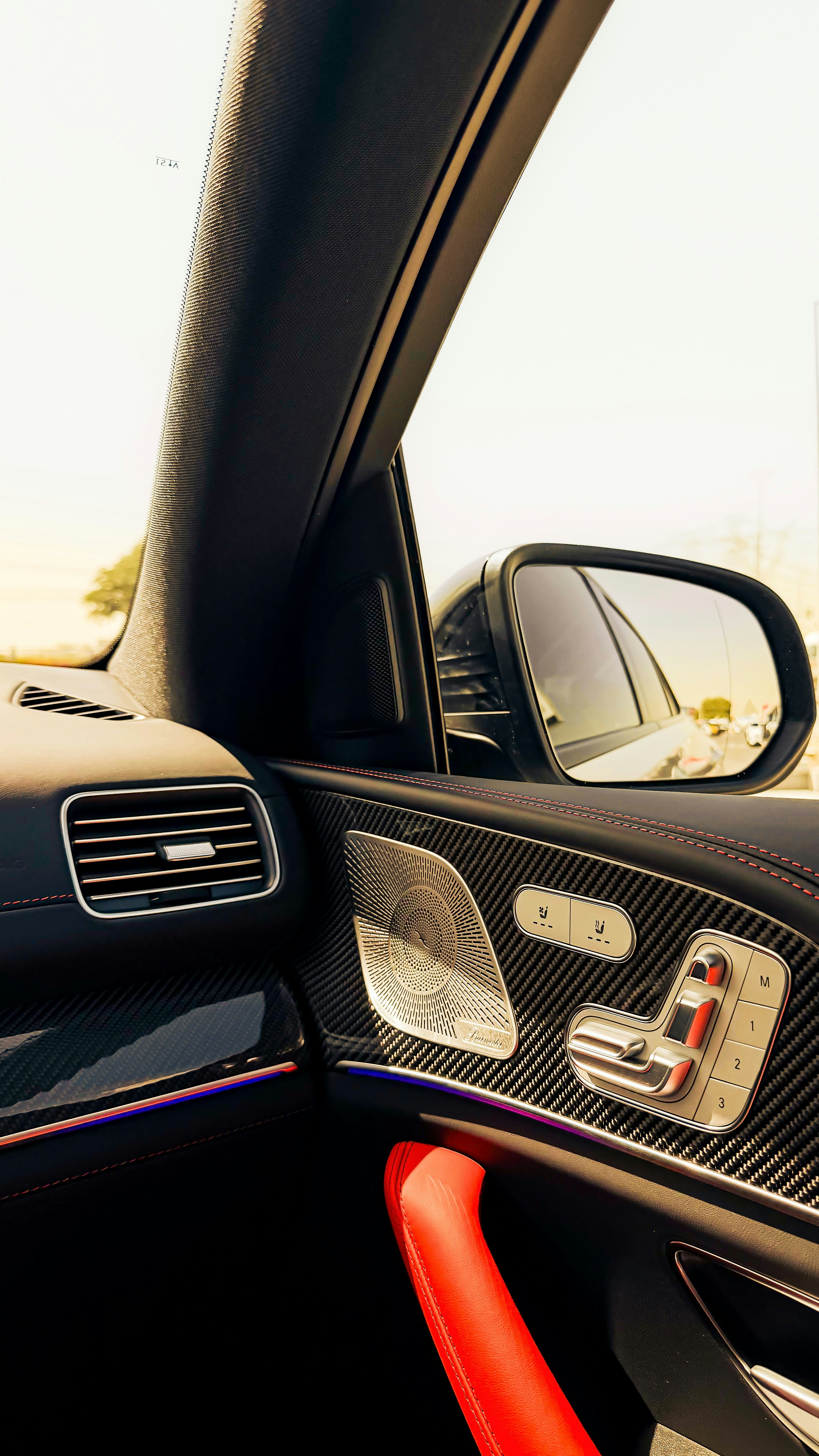 Lux Car Lounge: Red Accent Grip Meets Carbon Dash