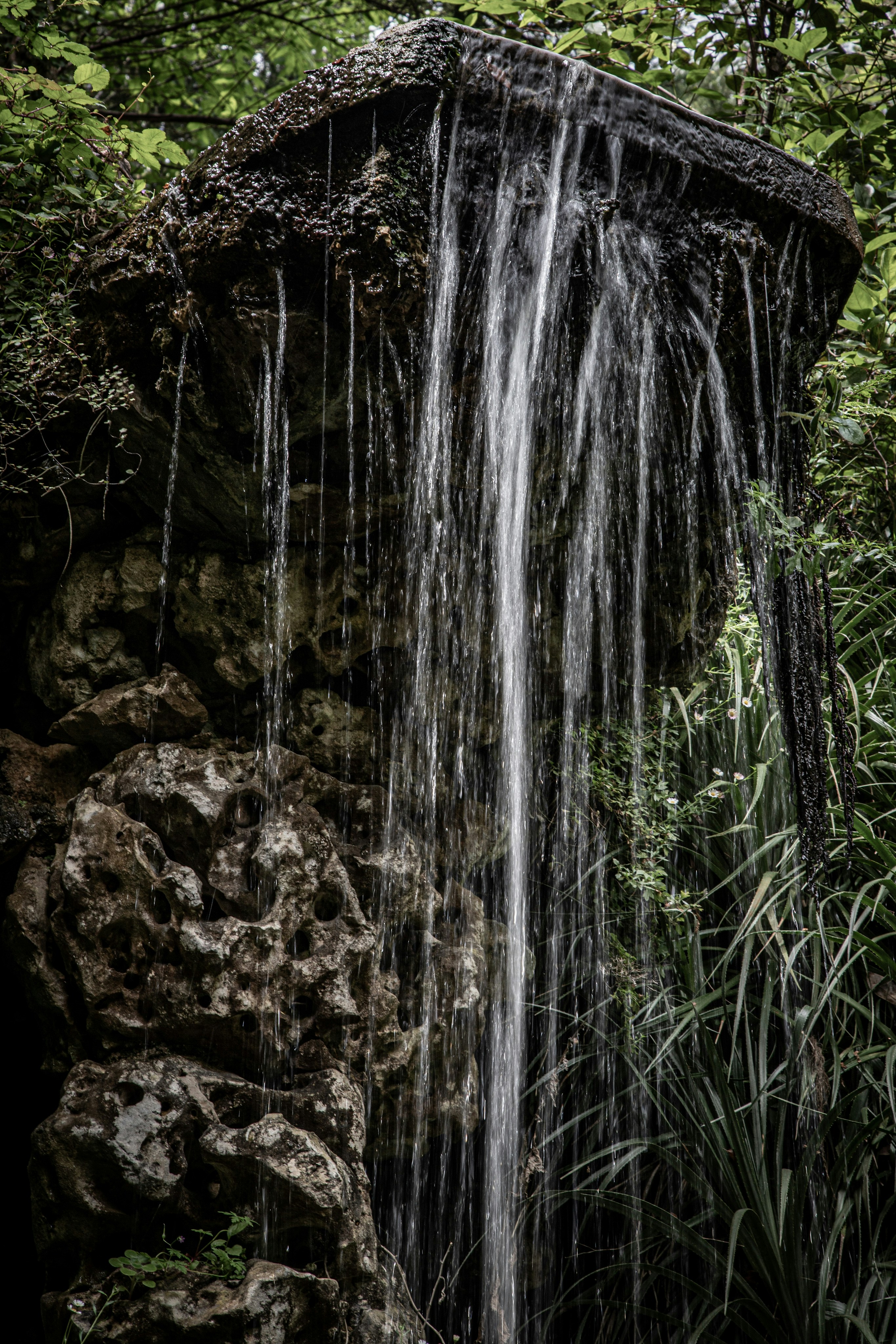 Moonlit Cascade: Mossy Overhang with Veil of Water