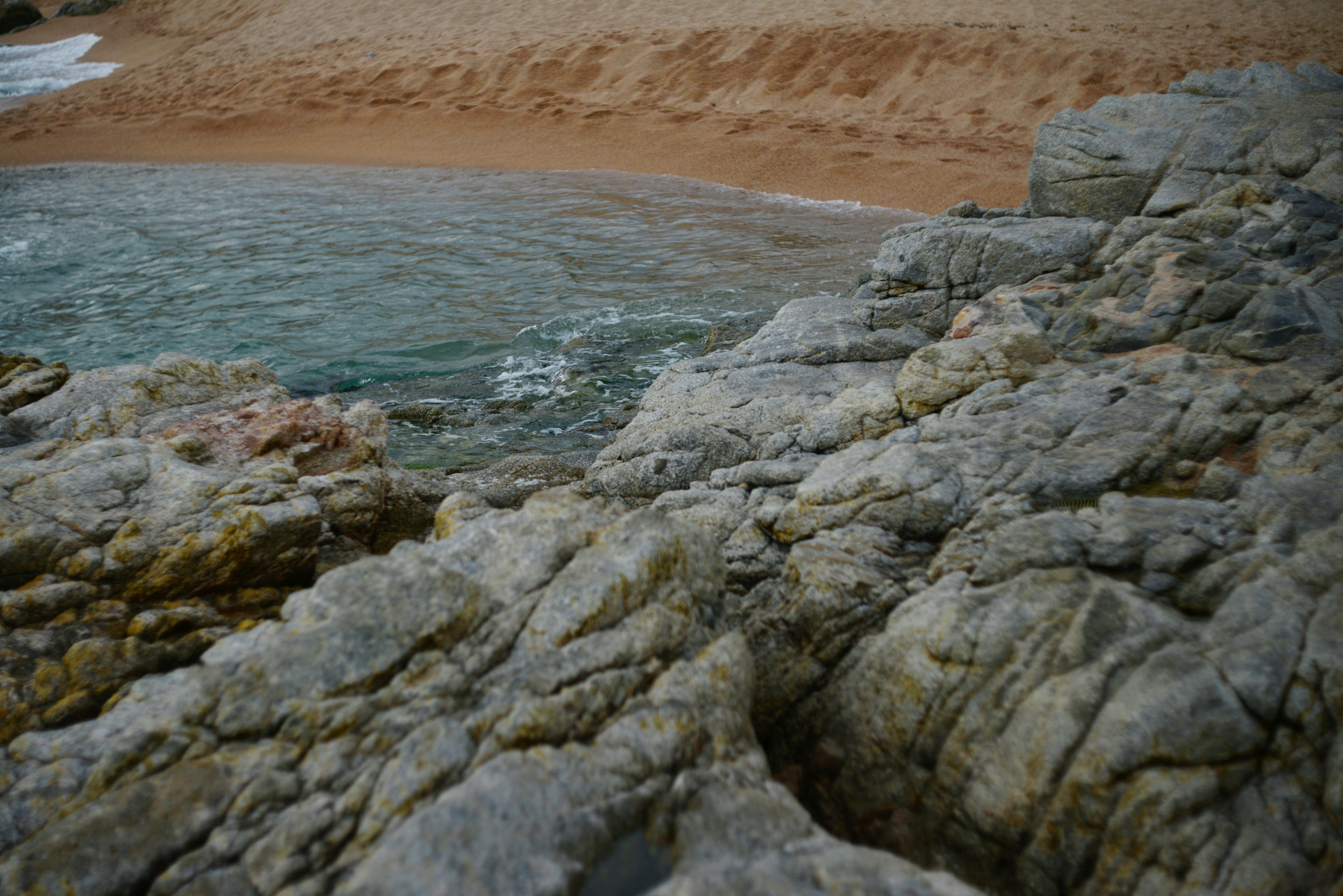 Rugged shoreline: weathered rocks guarding a quiet cove