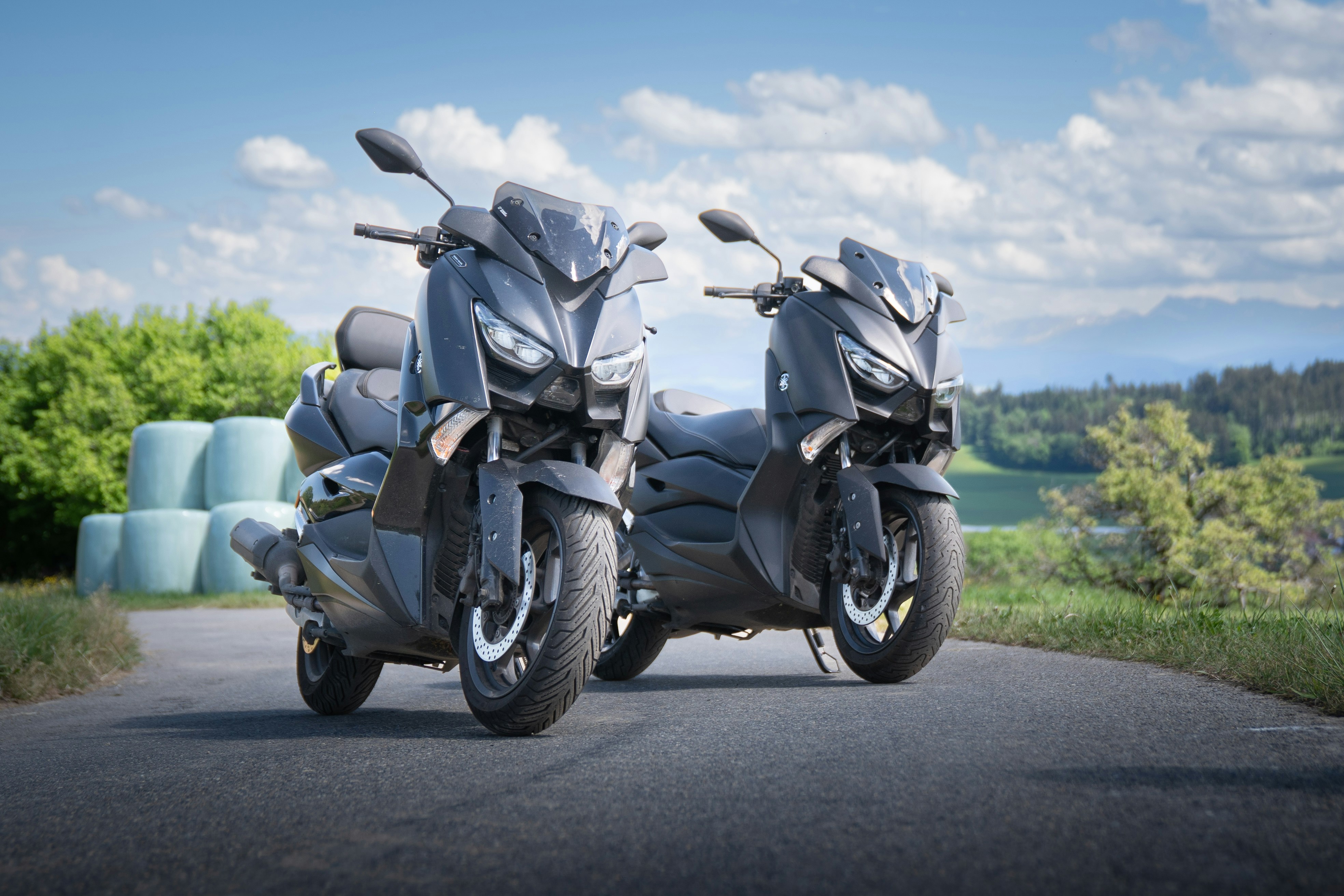 Twin Stance: Two Modern Scooters On a Quiet Rural Road