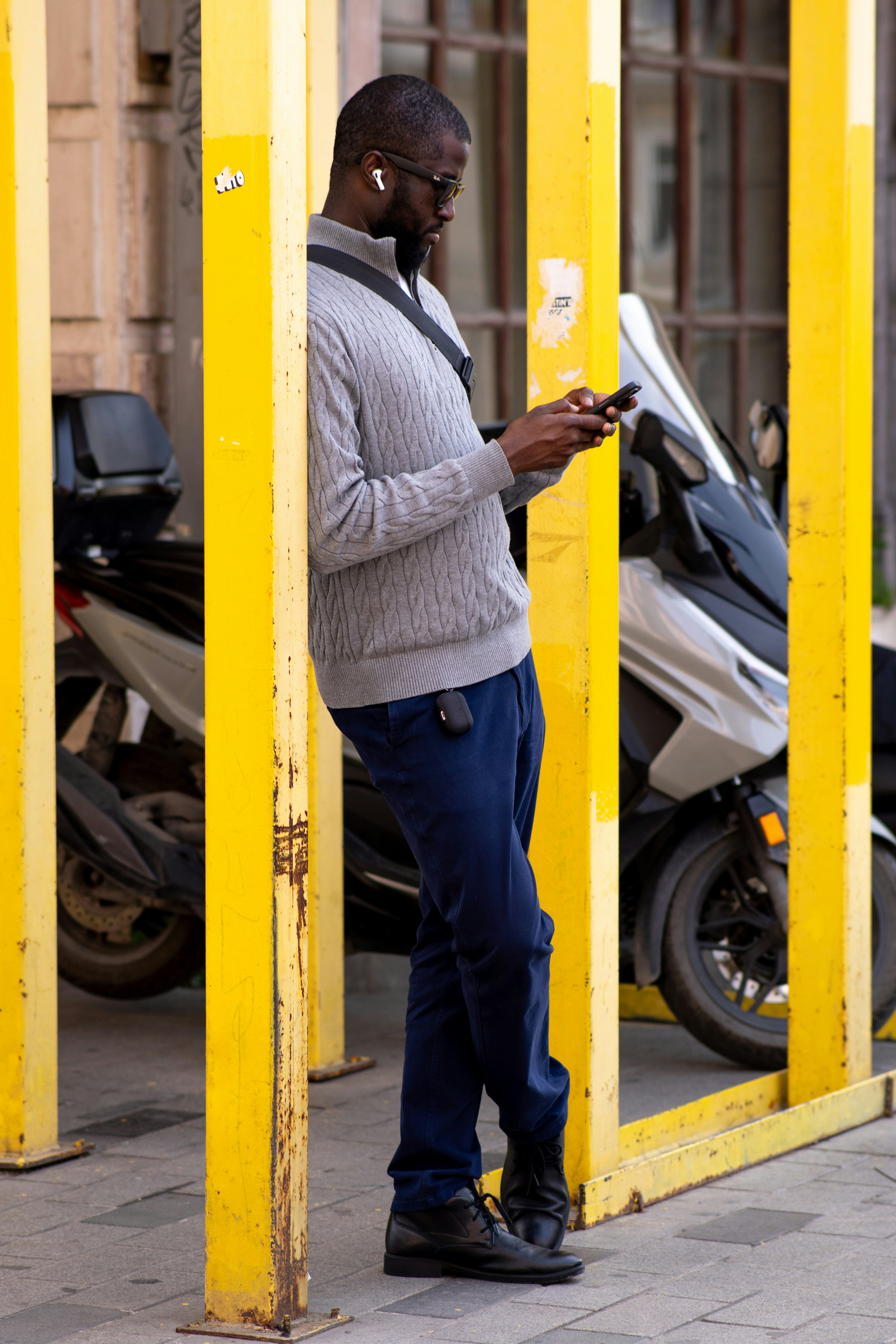 Code-Red Pause: A Man in a Knit Sweater Focused on the Screen