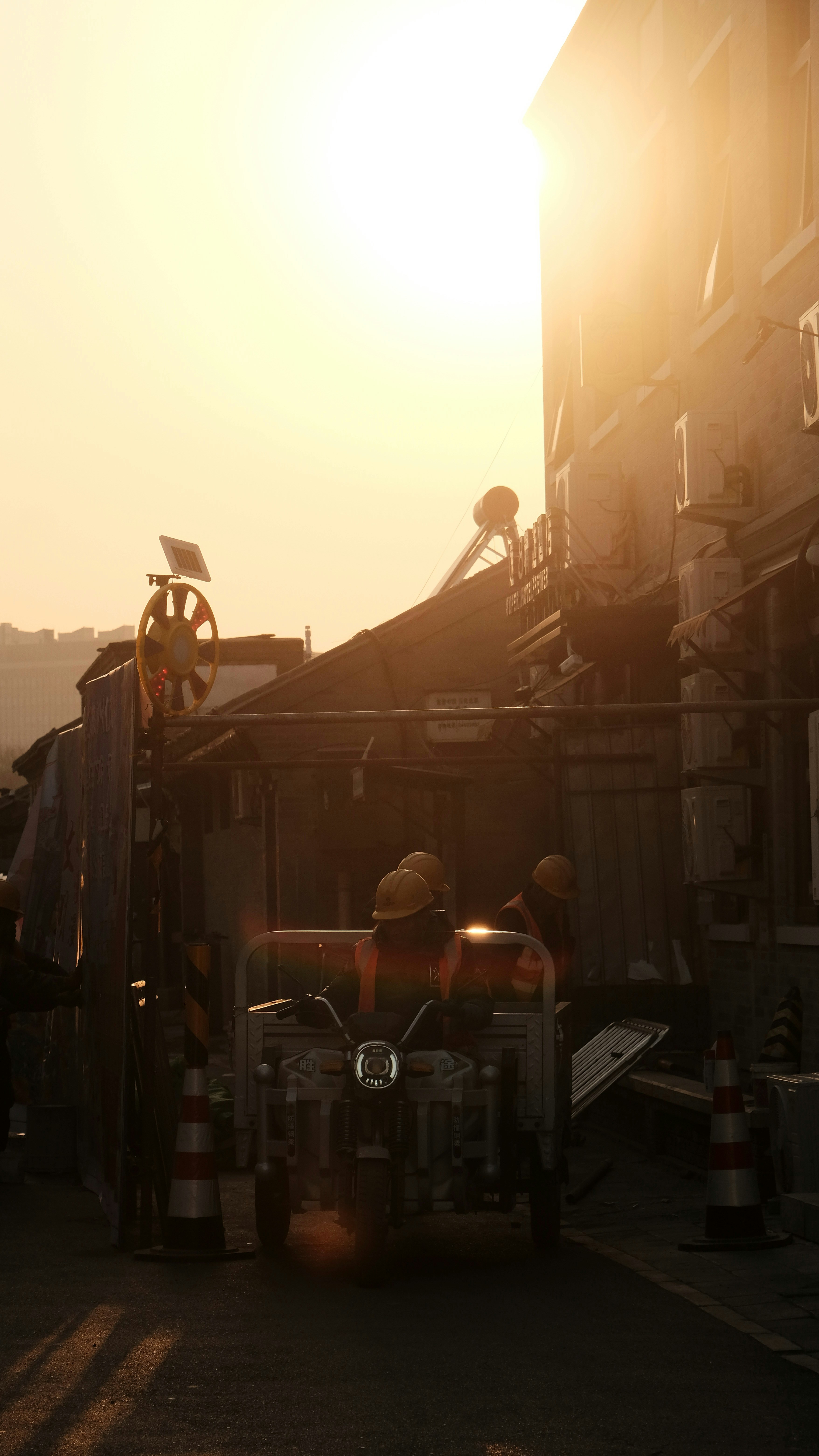 Sunlit Alley: Construction Crew in a Golden Hour Moment