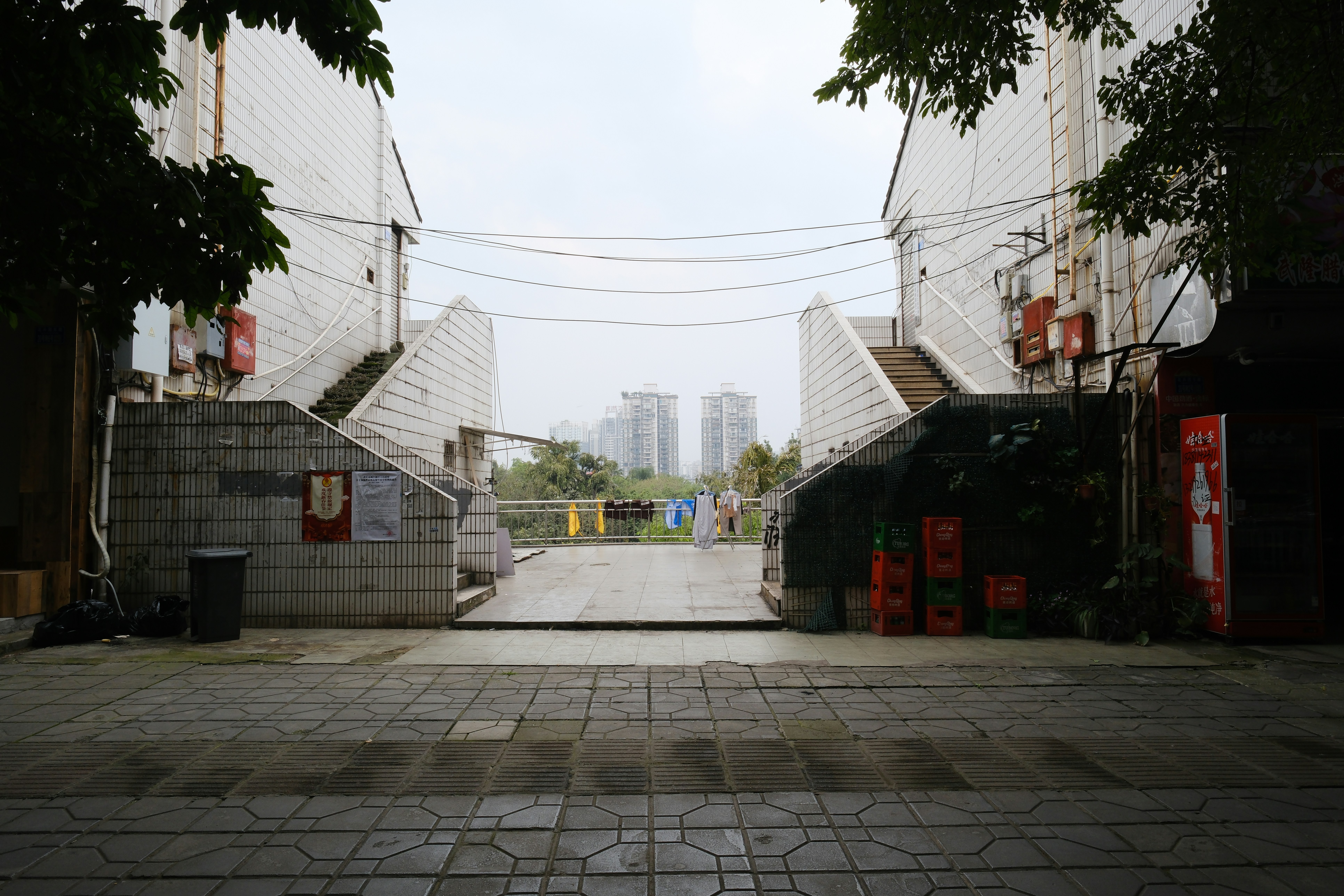 Gateway Collapse: A Quiet Urban Crossing Framed by Symmetrical Ramps