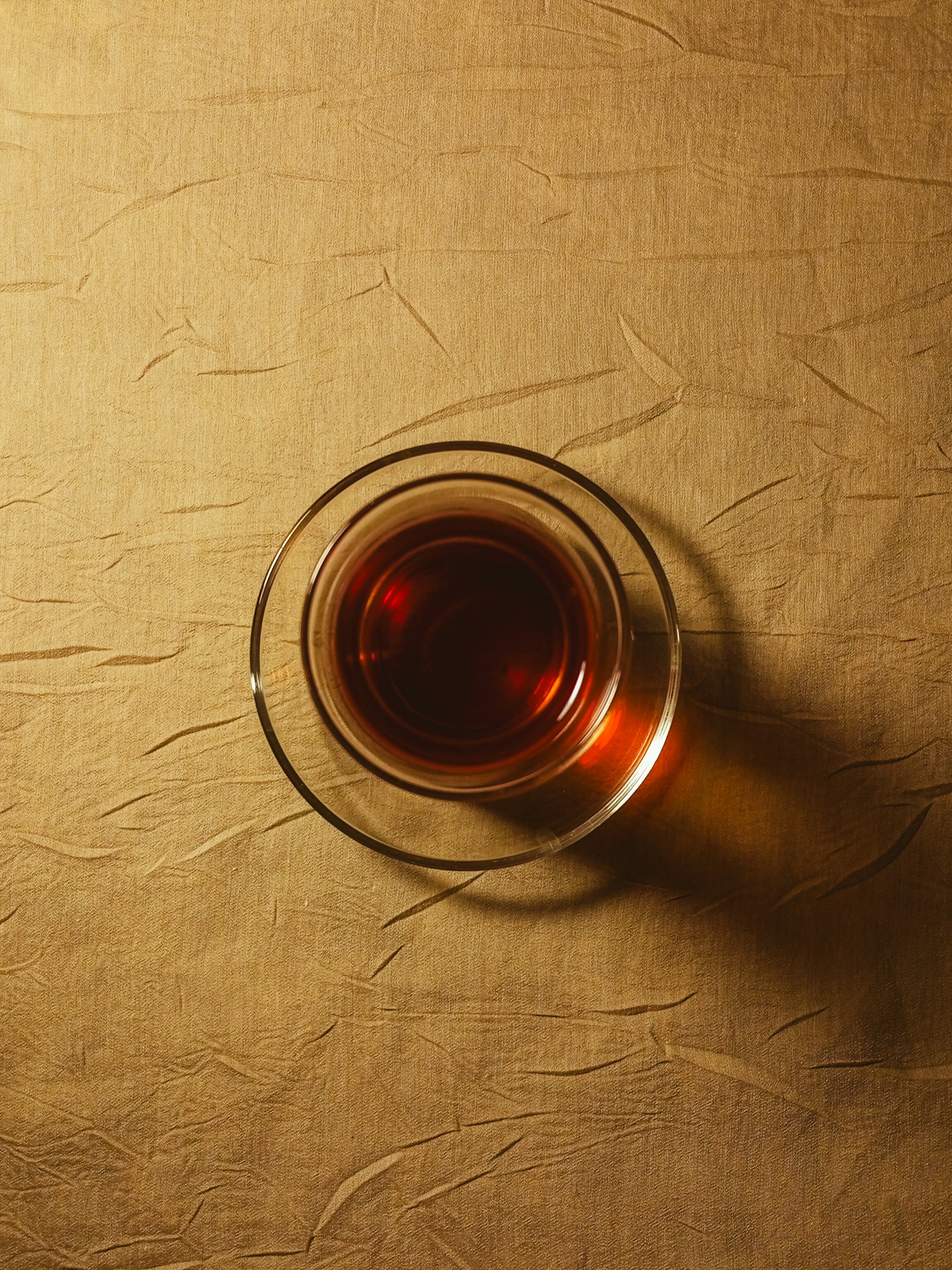 Amber Glow: A Top-Down Moment with a Glass of Tea