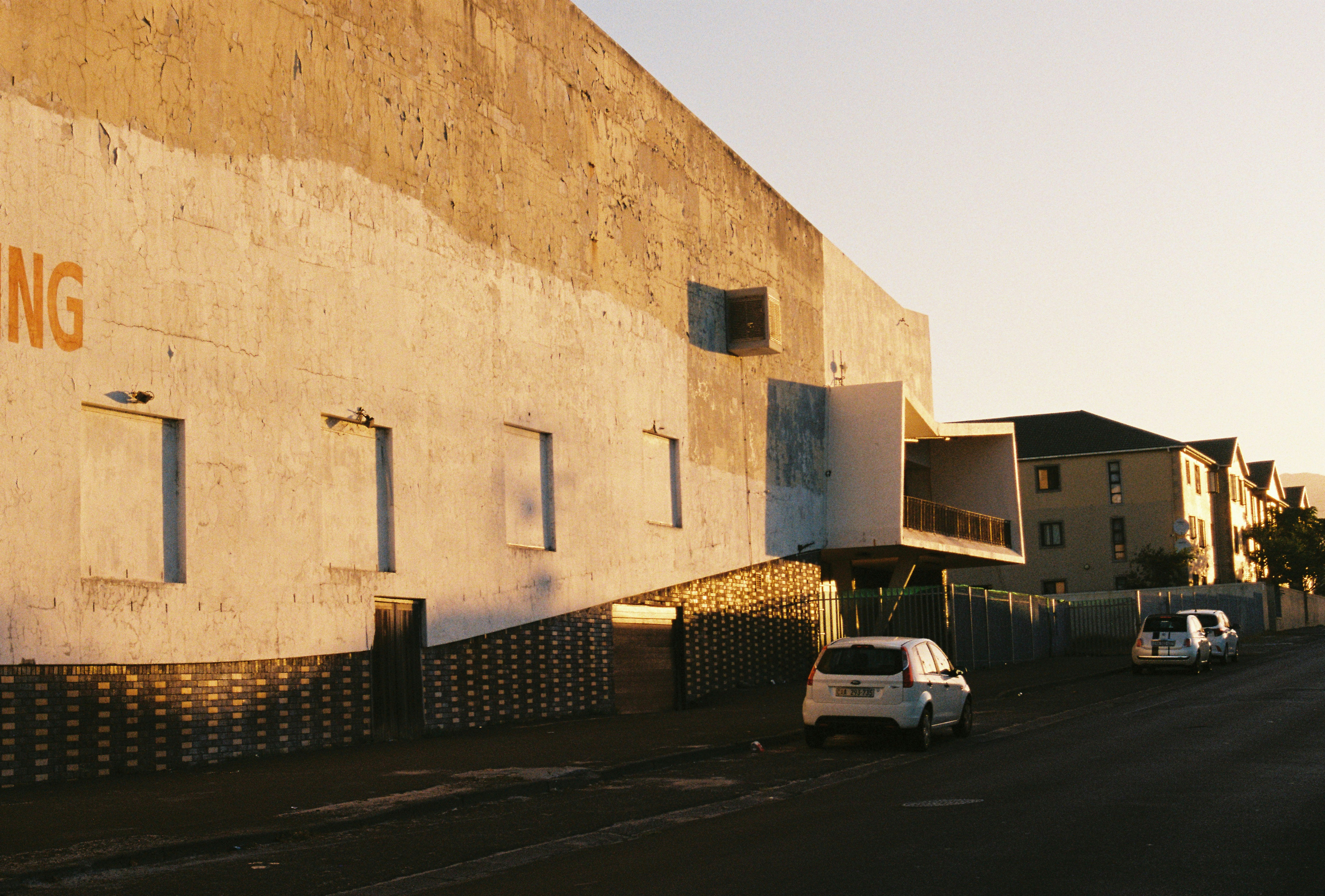 Industrial Sunset Over a Quiet Street
