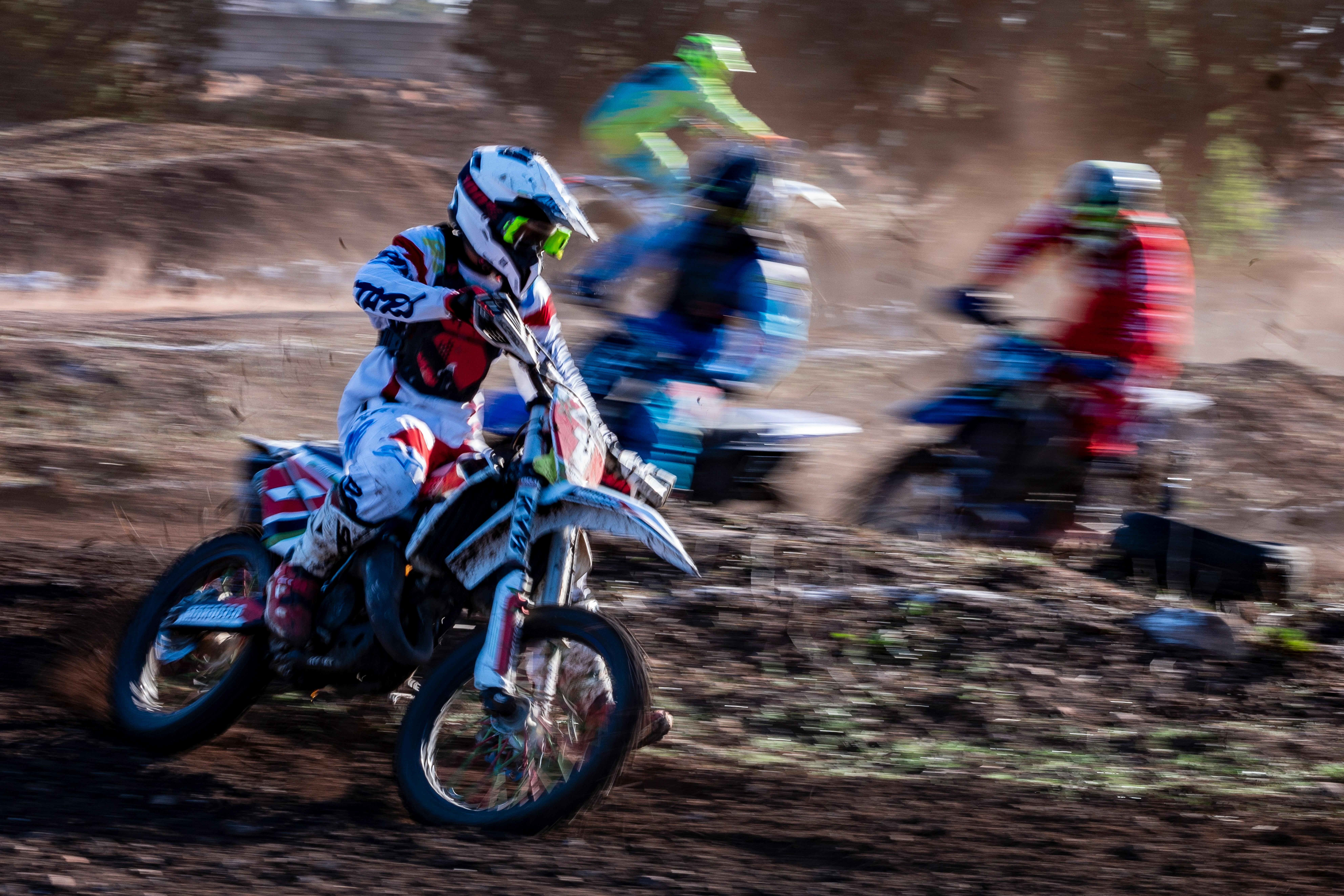 Front Rider in a Dusty Dash: A Motocross Pursuit
