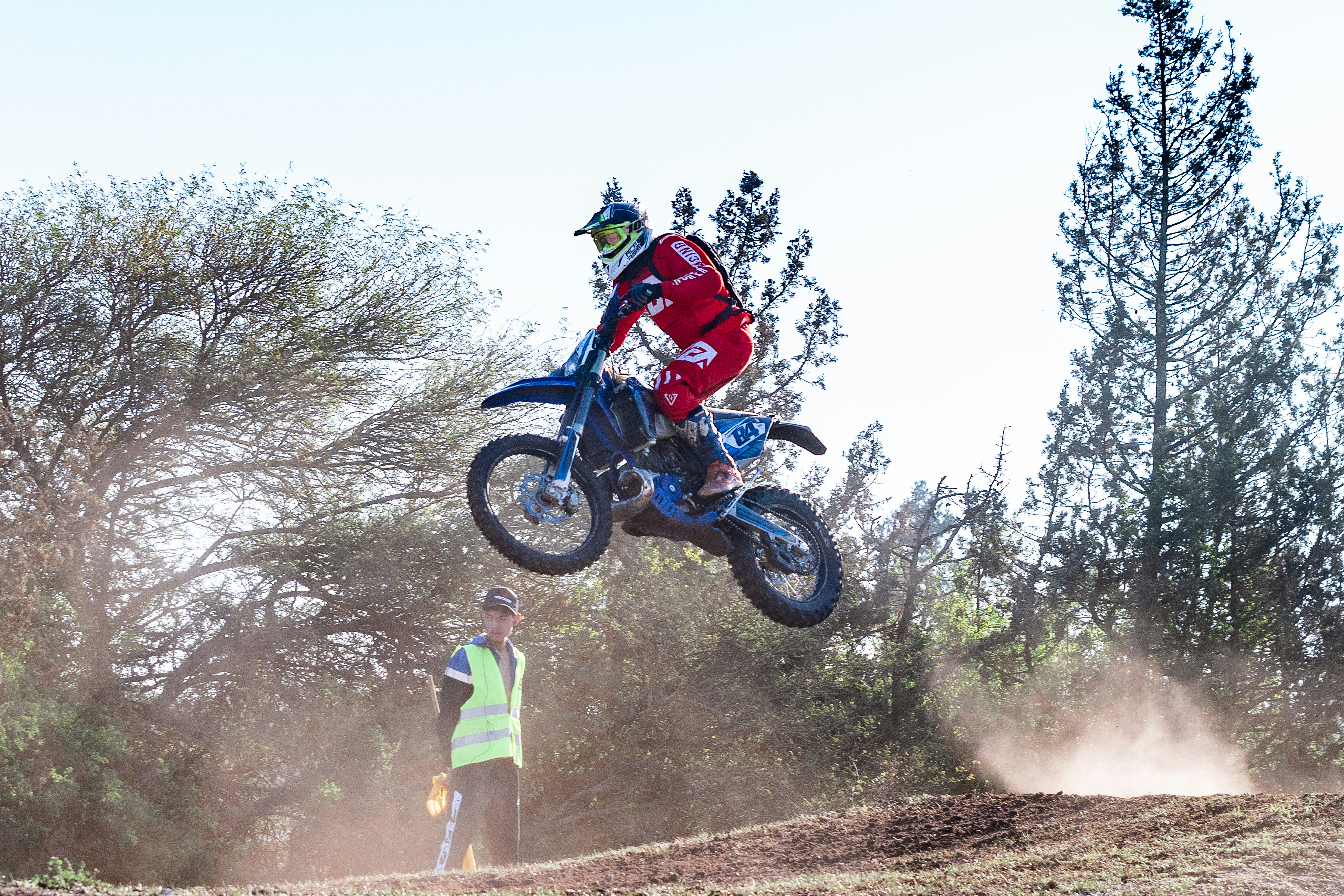 Leap of Dust: Rider Soars Over the Dirt Jump
