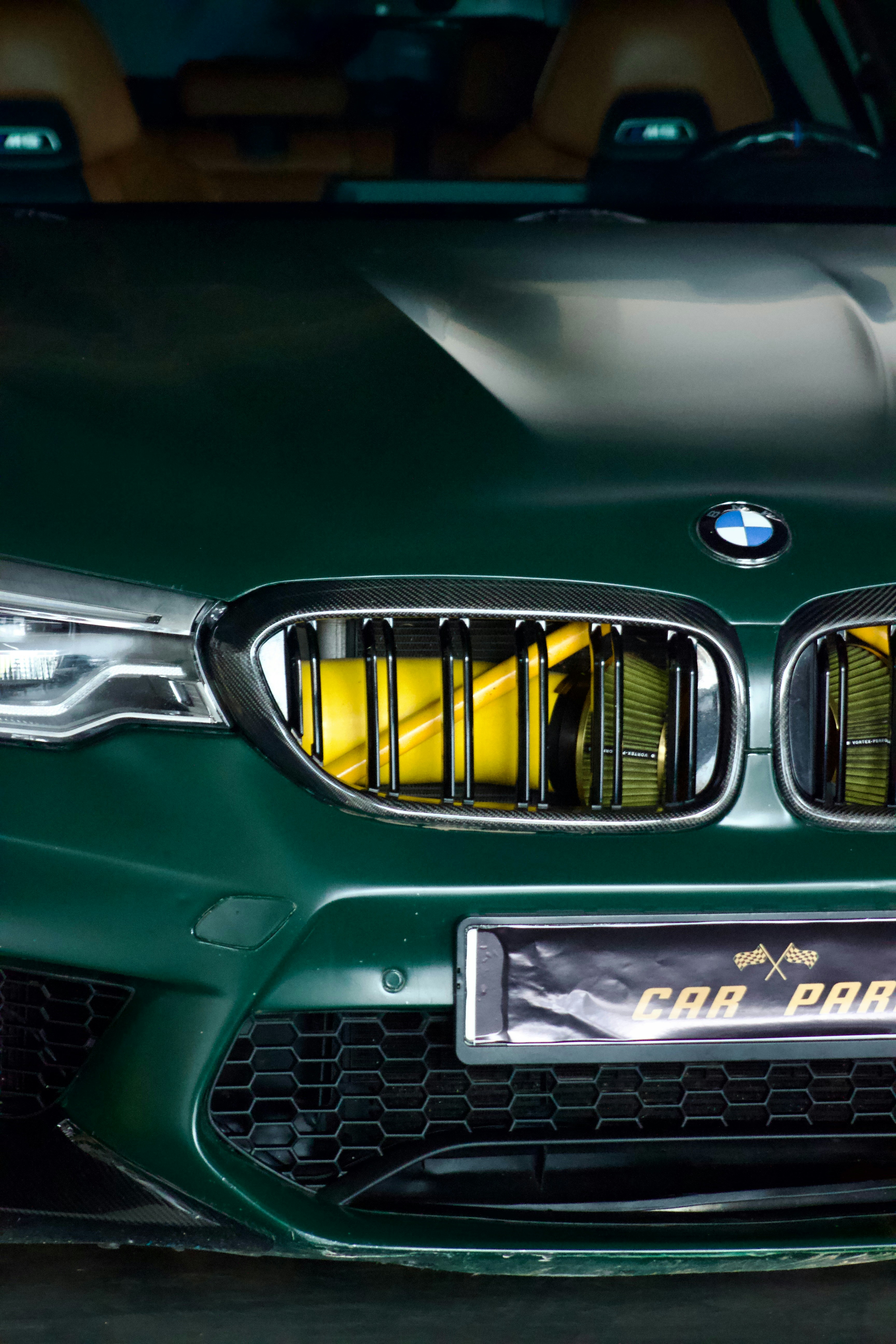Green BMW Grille Stare: A Close-Up of Power and Detail