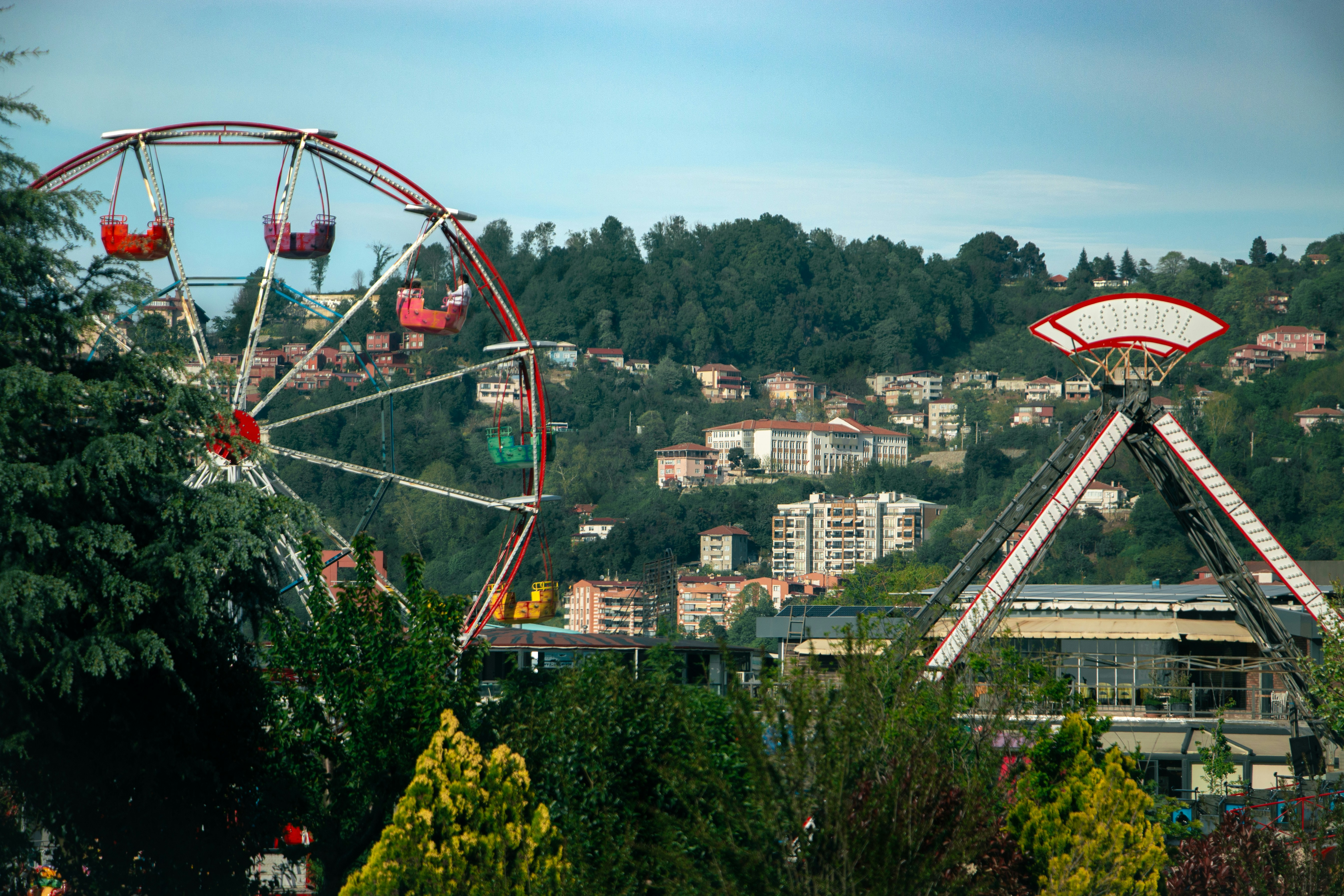 Ferris Wheel Overlooking a Sloped Town