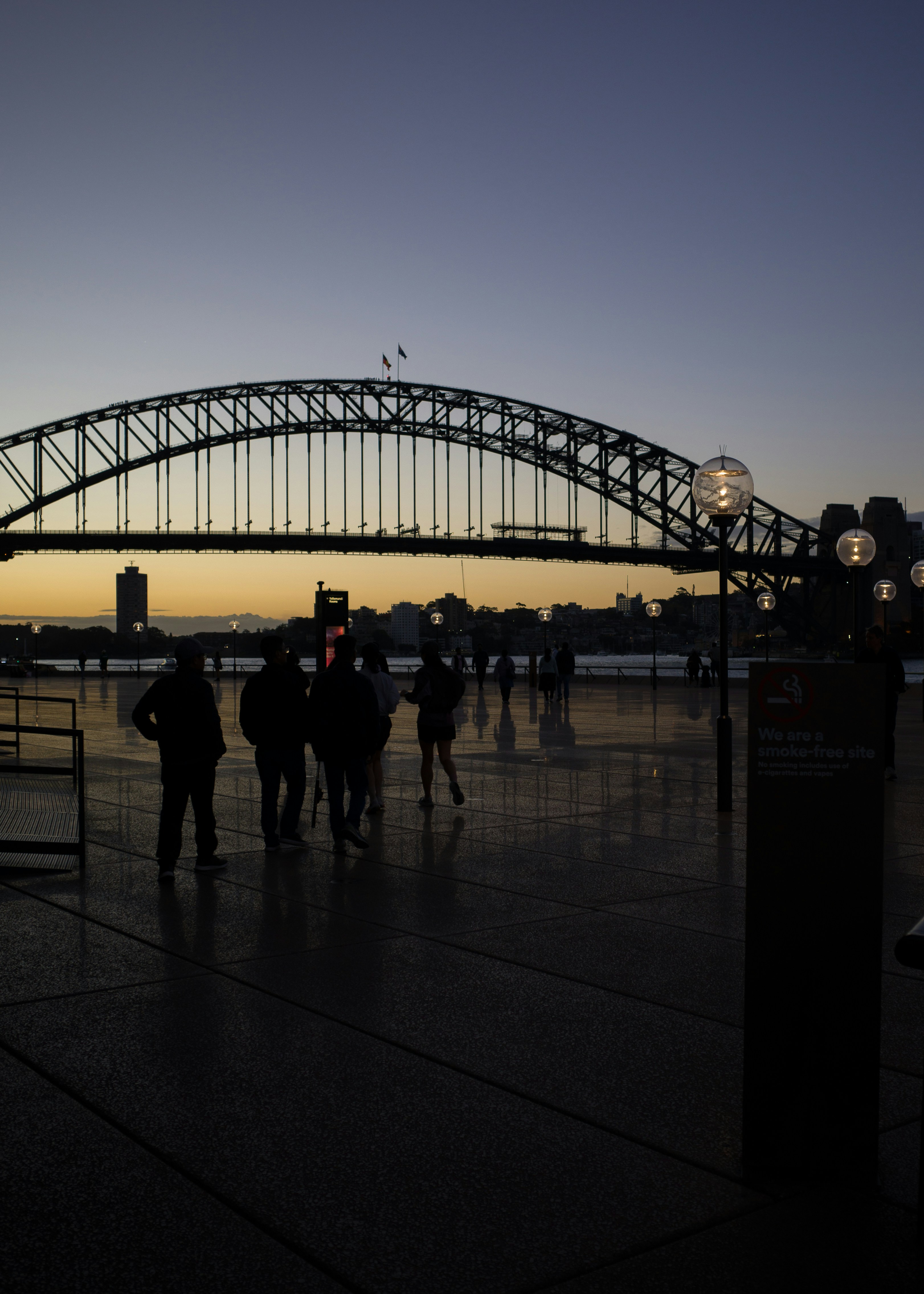 Sunset Silhouettes under the Harbor Bridge