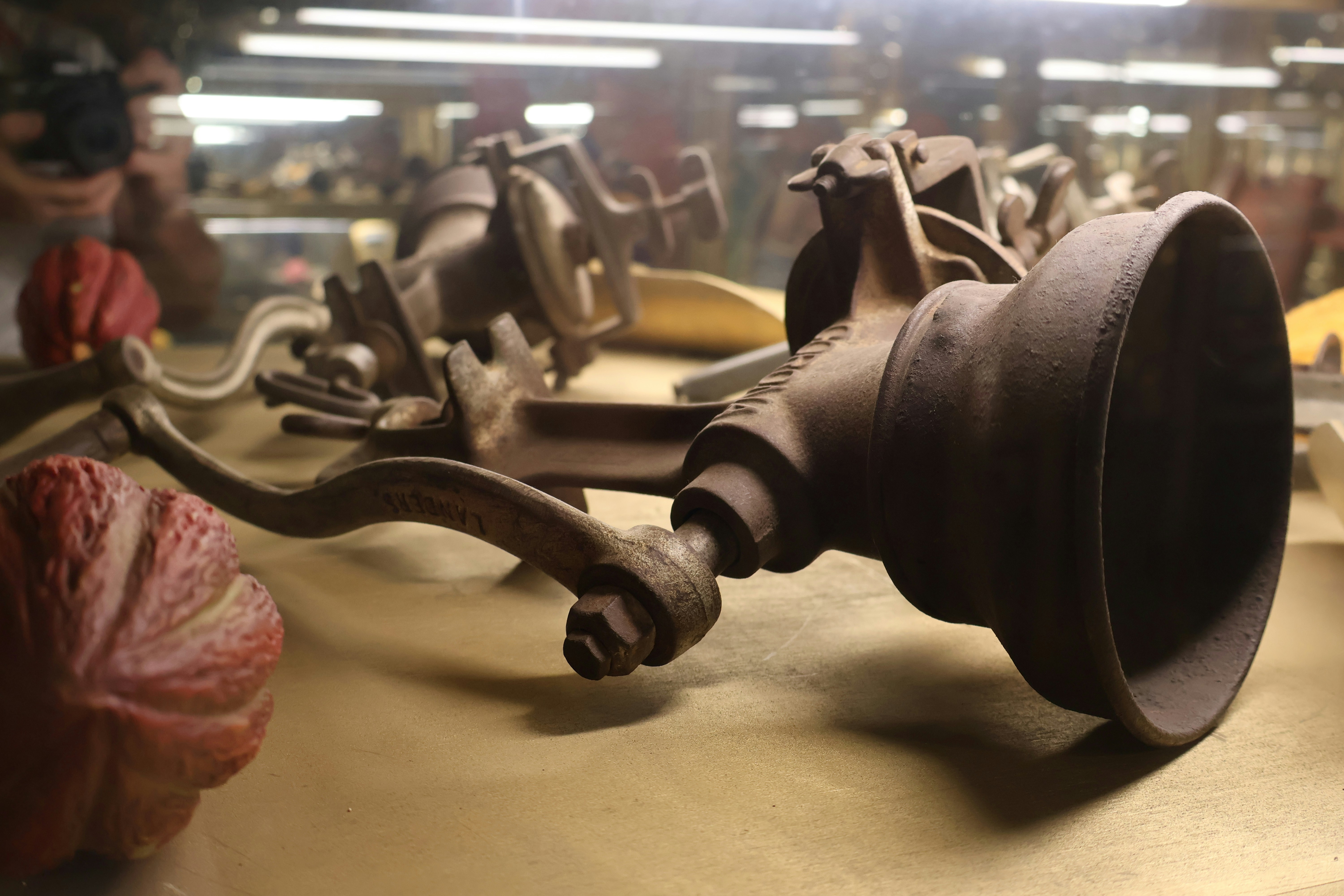 Dusty Fantasia: A Close-Up of a Vintage Grinder in a Dim Workshop