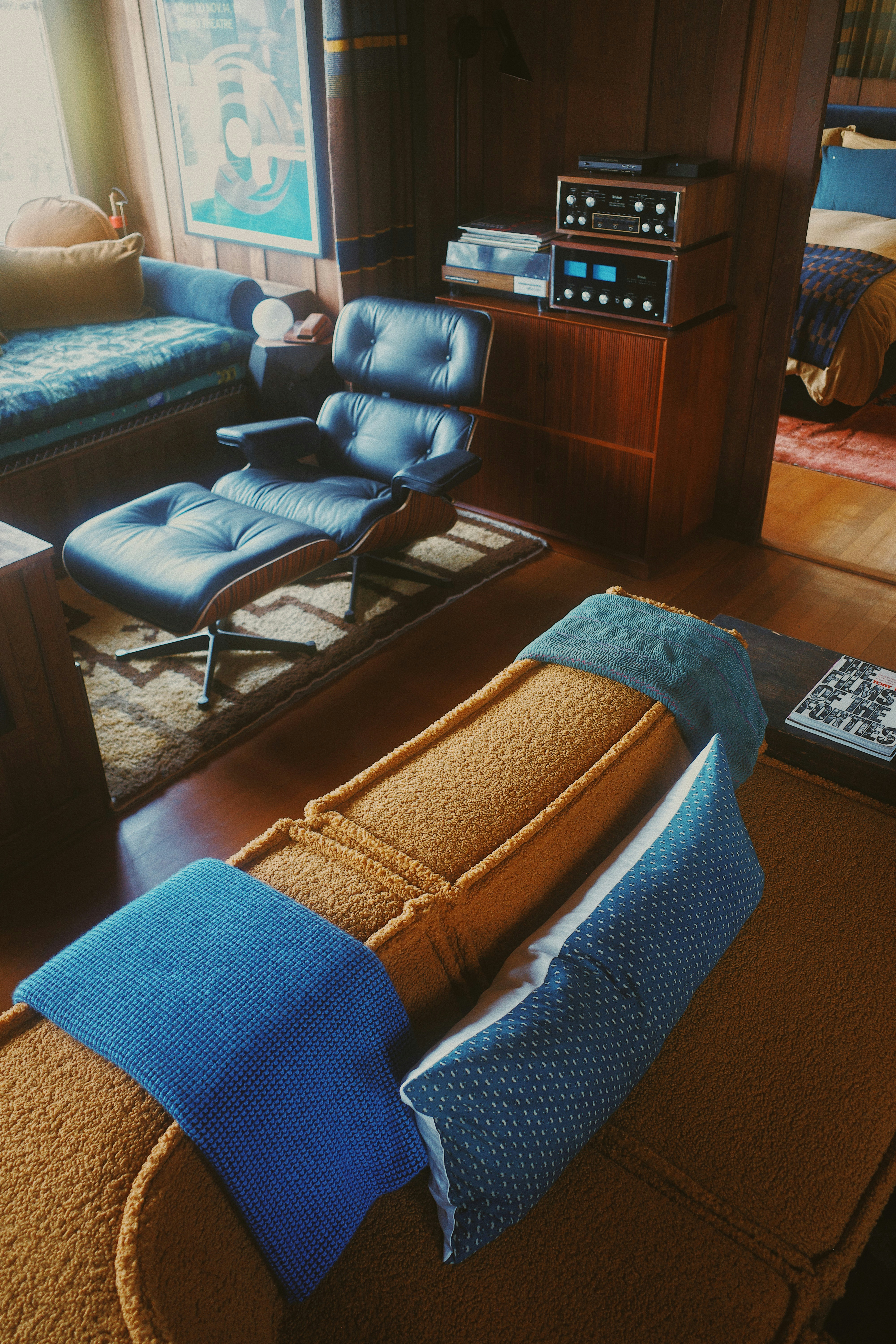 Mid-Century Living: Eames Lounge and Wood-Toned Serenity
