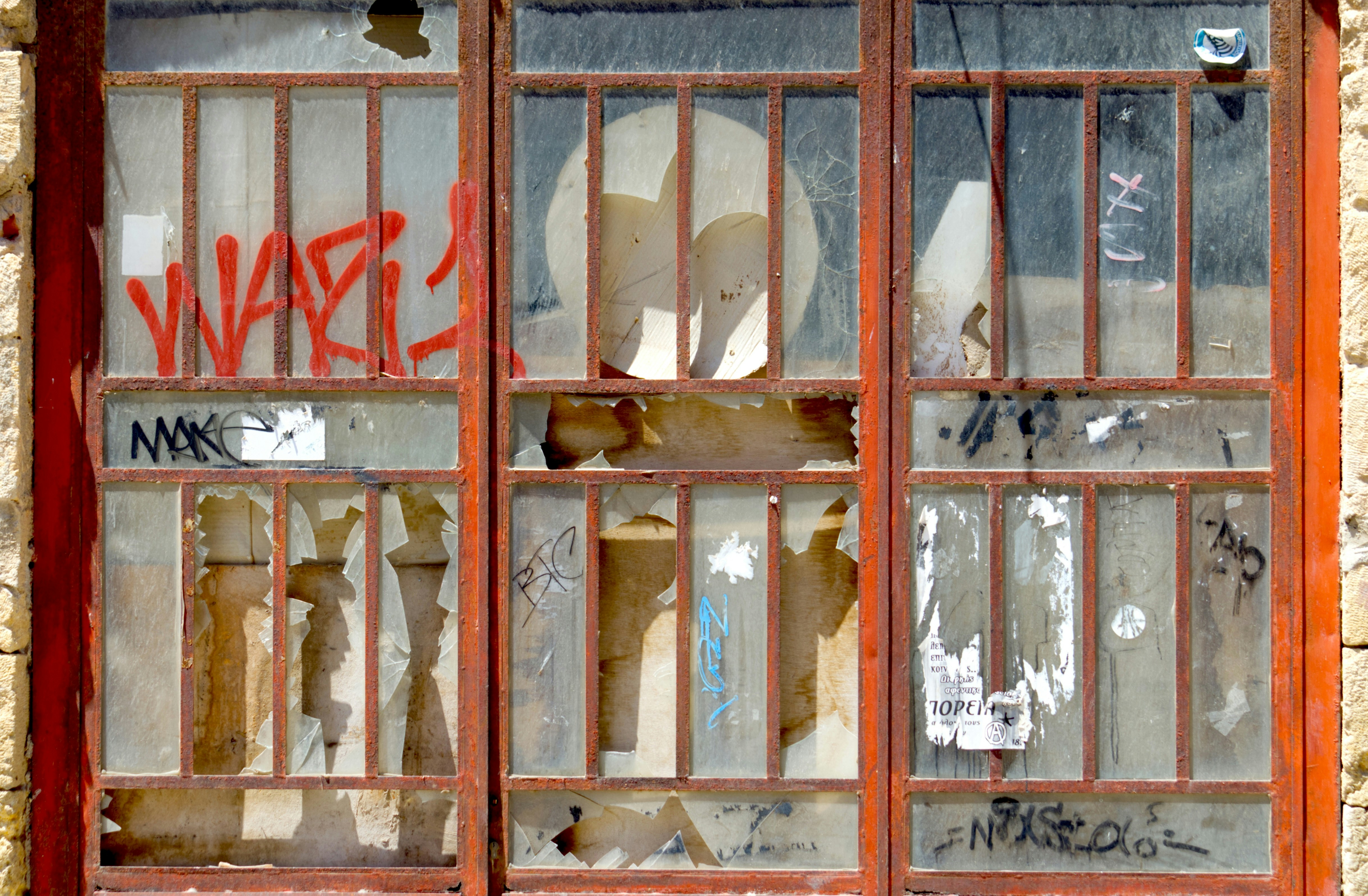 Graffiti-ironed Window: Framed Layers of Decay