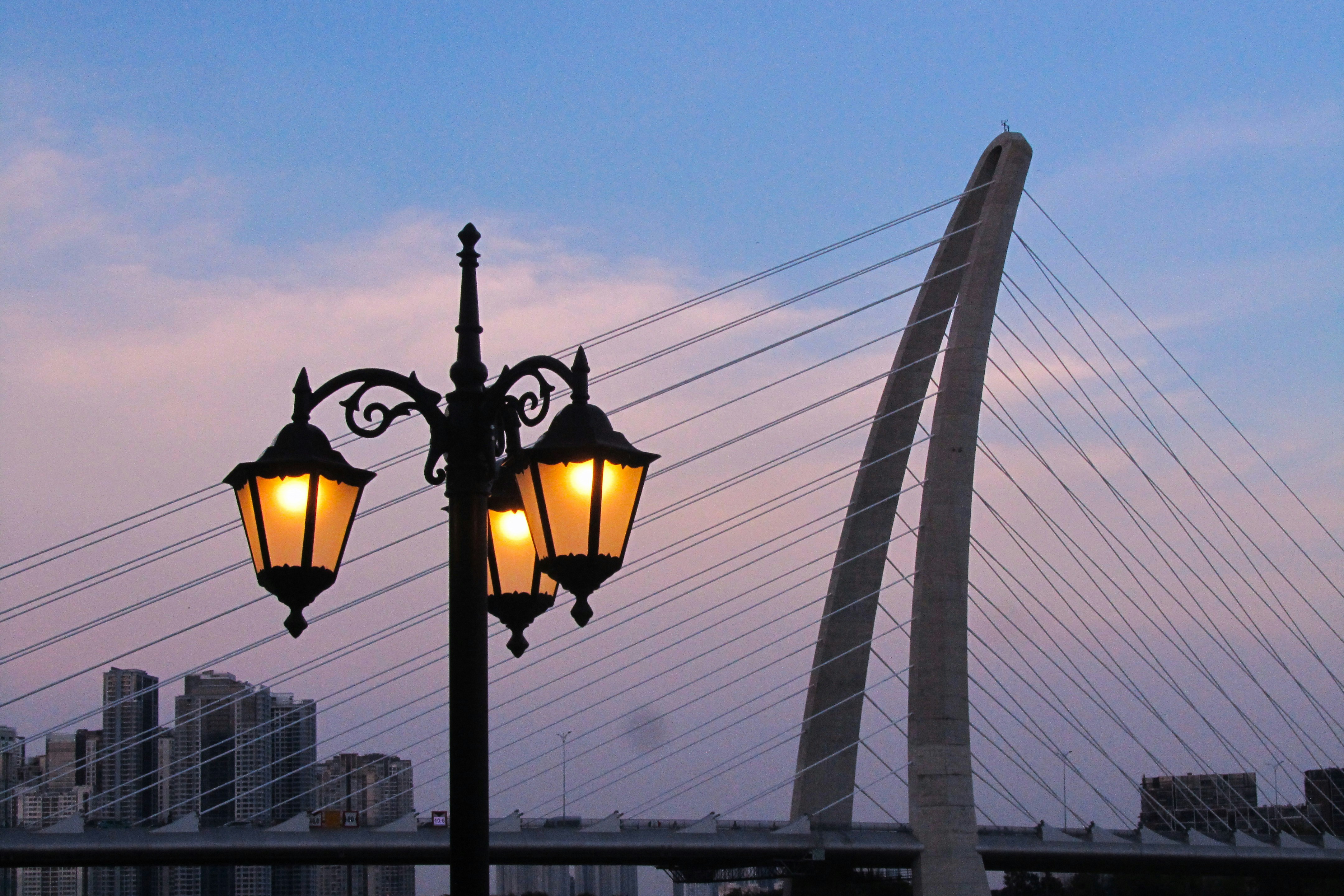 Lanterns Over the Arc: City Bridge at Dusk