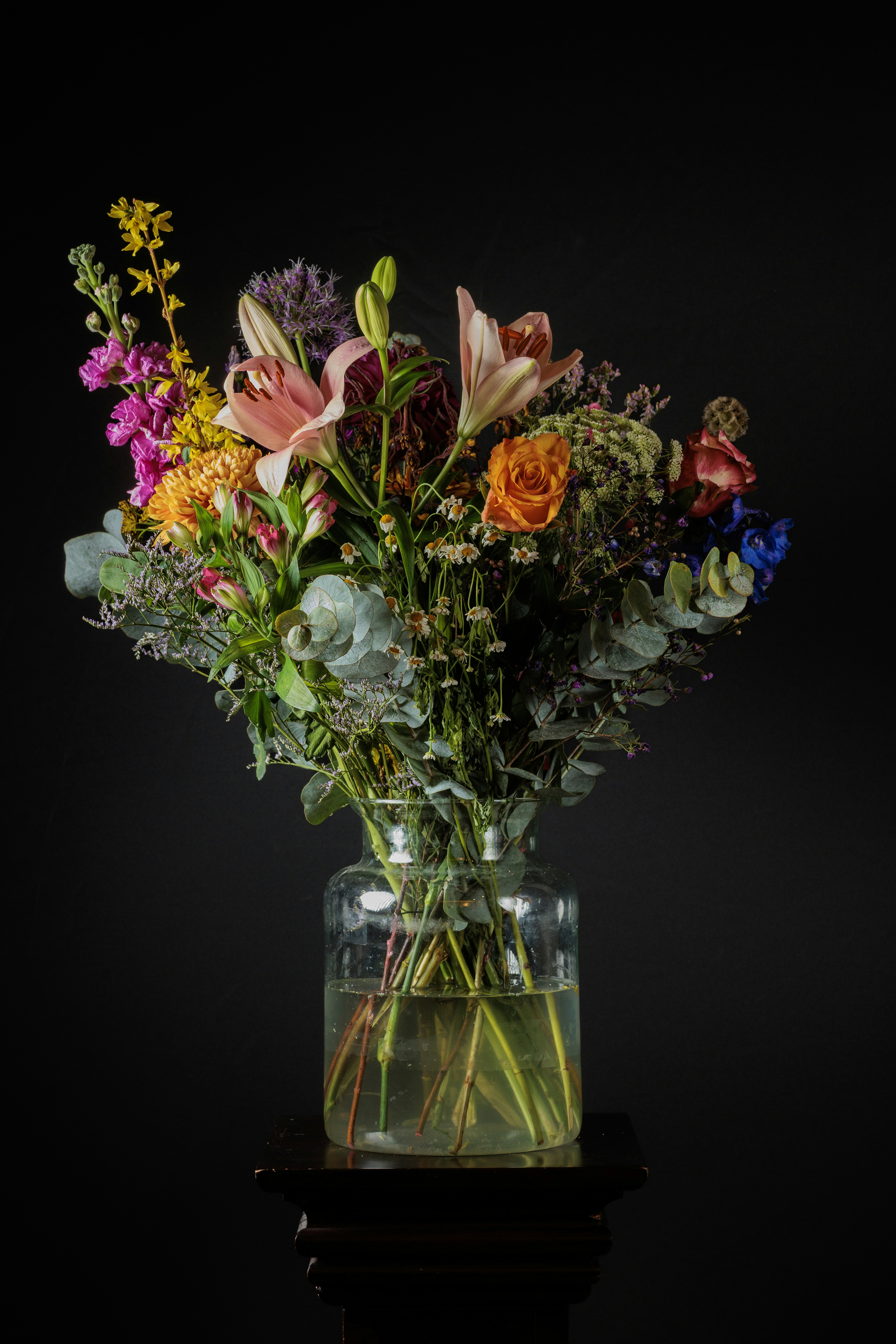 Vibrant Bouquet in a Glass Vessel: A Studio Portrait of Color and Calm