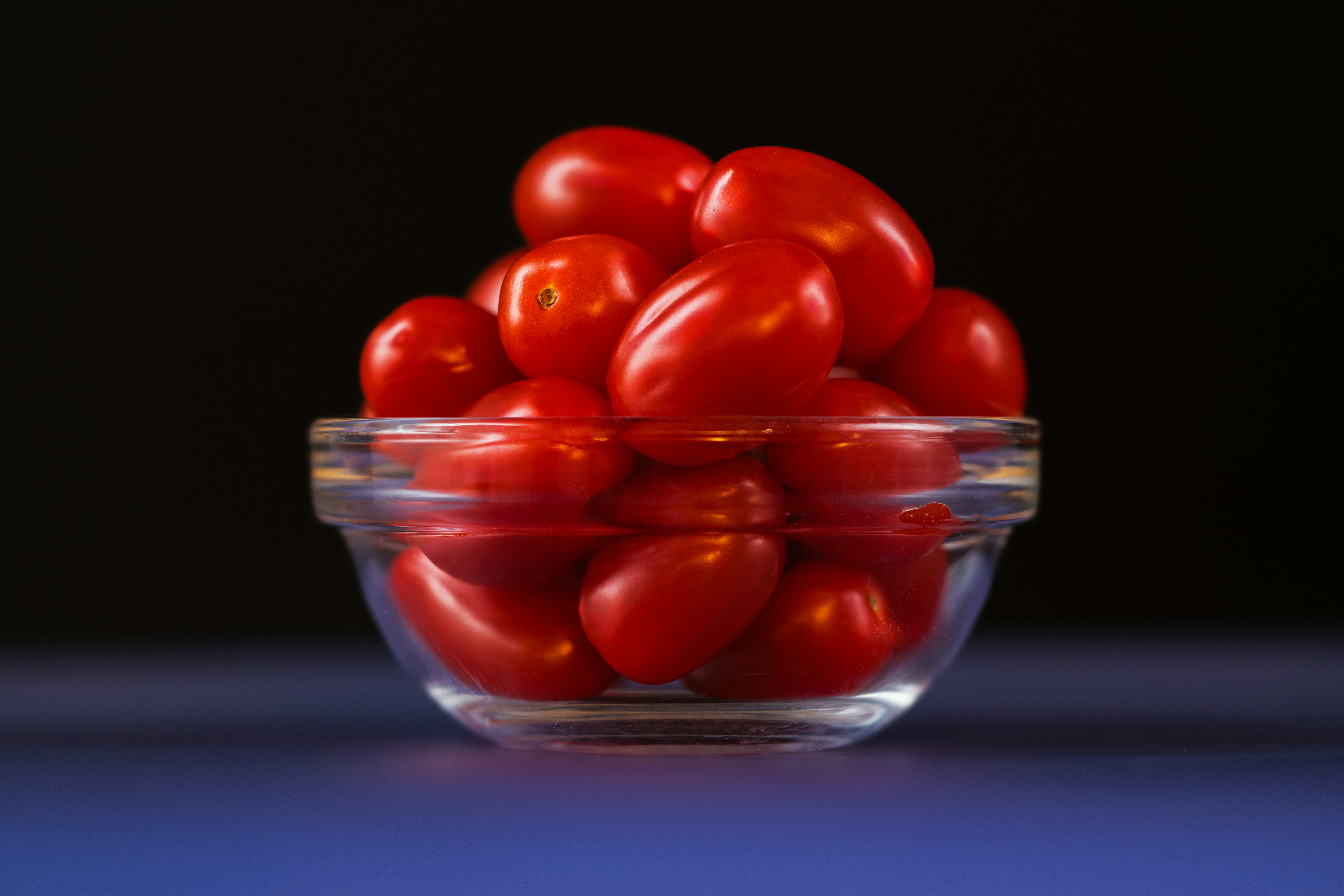 Crimson Globe: Cherry Bowl Centered in Soft Backstage Glow