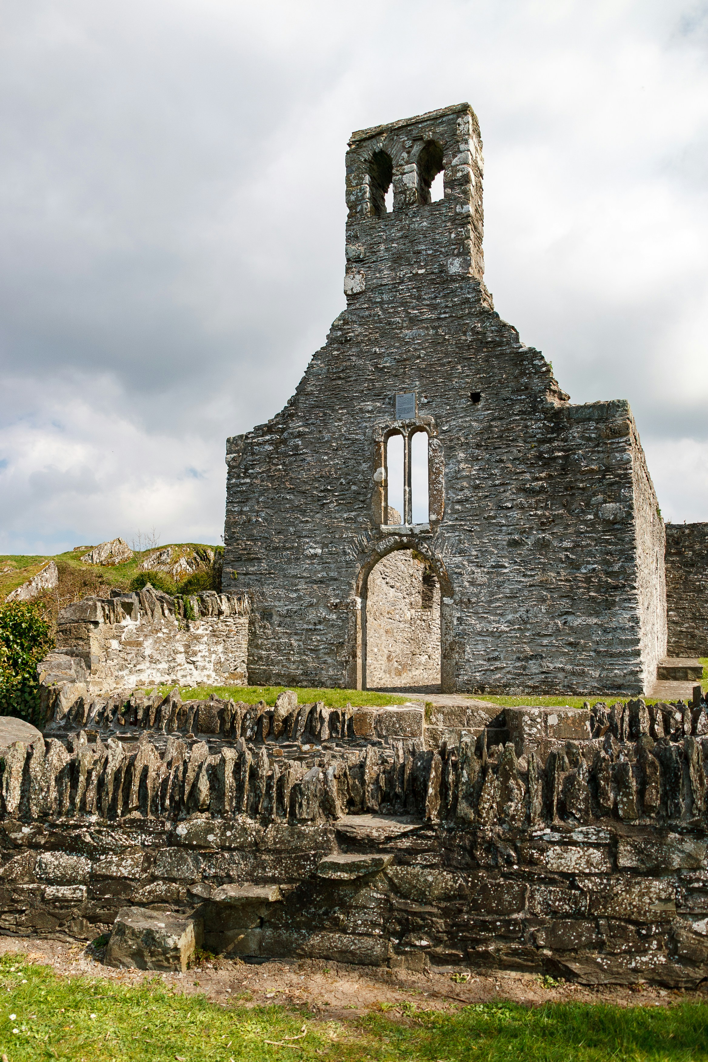 Ruined Chapel Bending Sky: Stone Arches in a Coastal Fortress