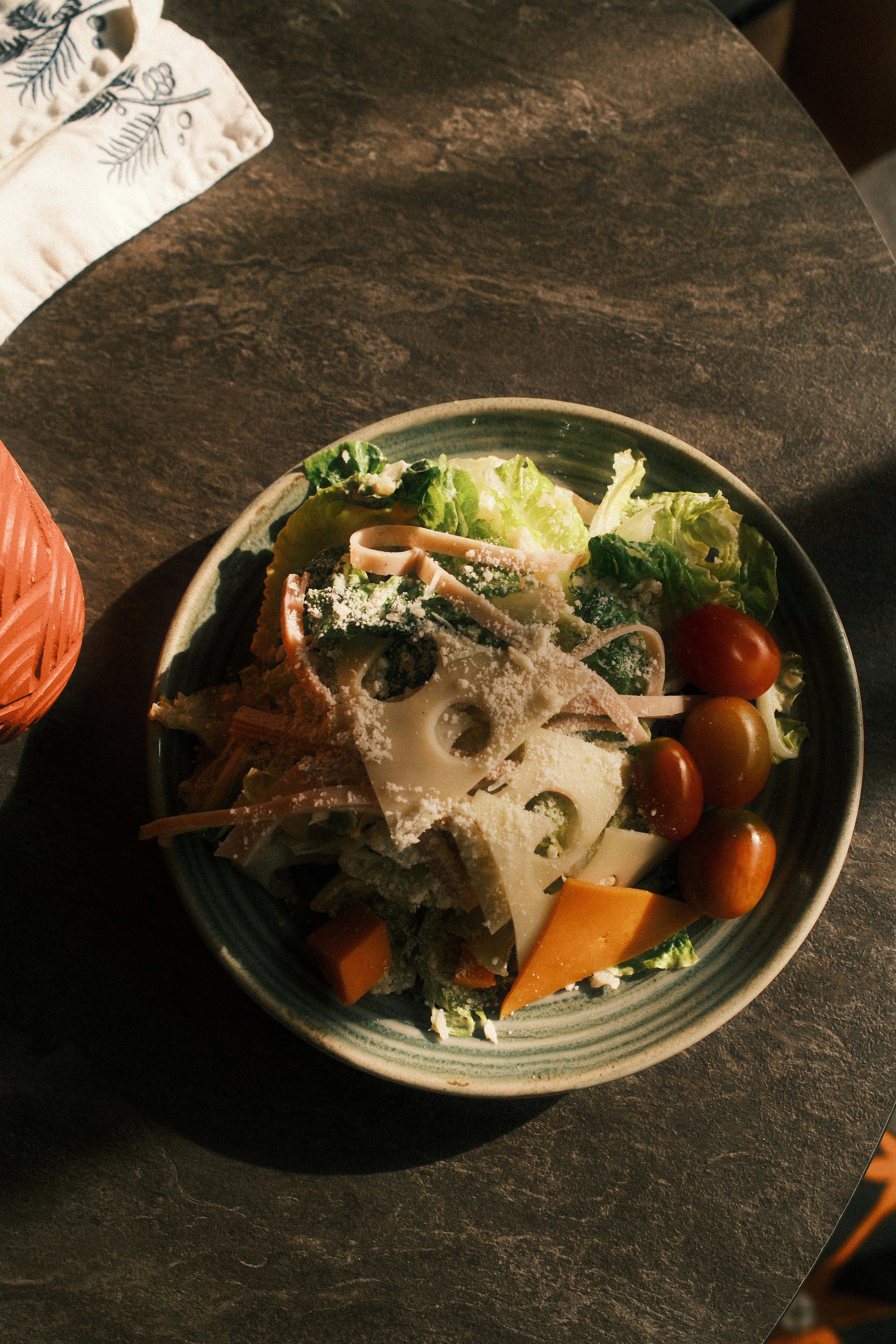 Citrus-green Bowl: A Garden Fresh Salad in a Rustic Ceramic