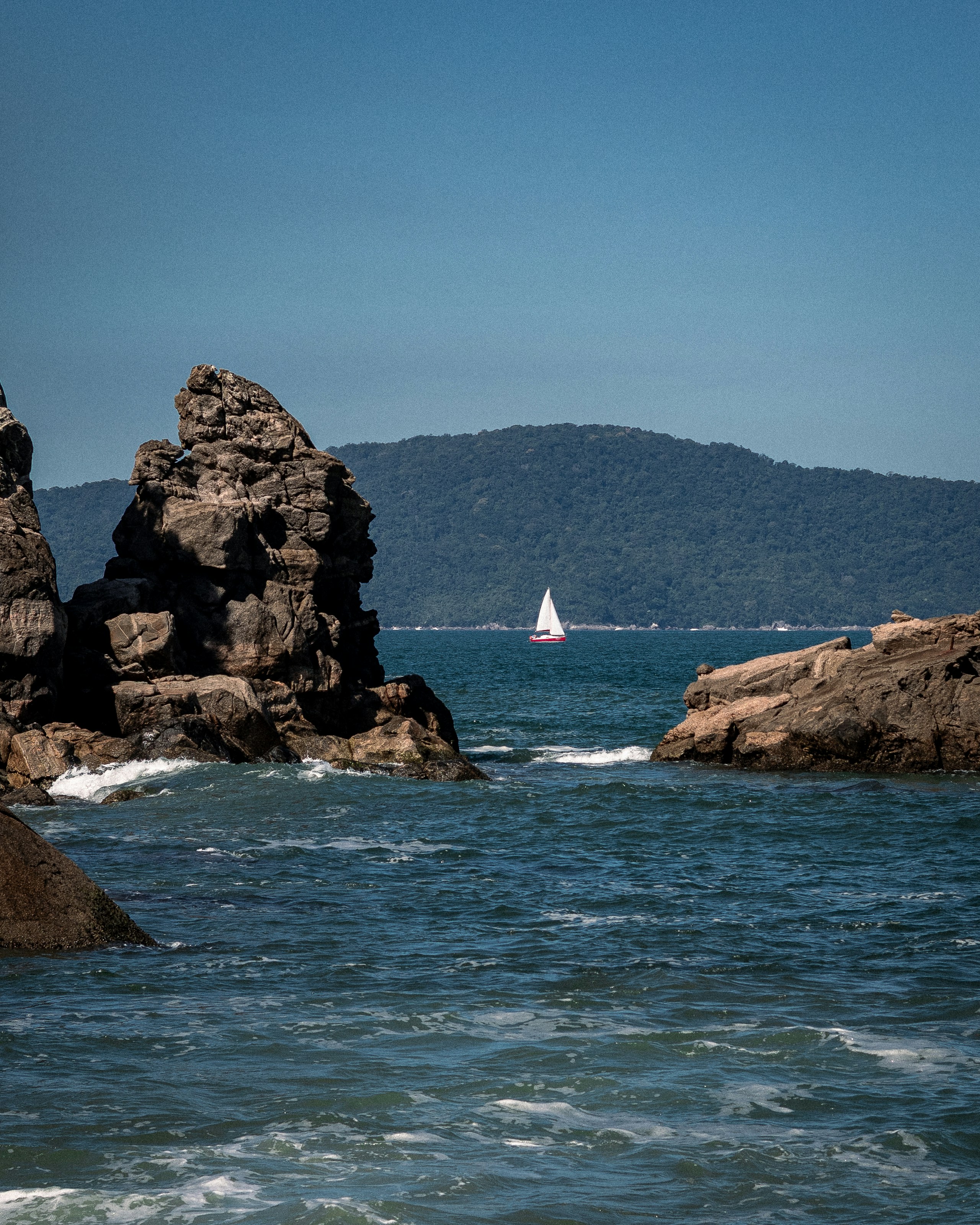 Sailboat Beyond the Rock Arch